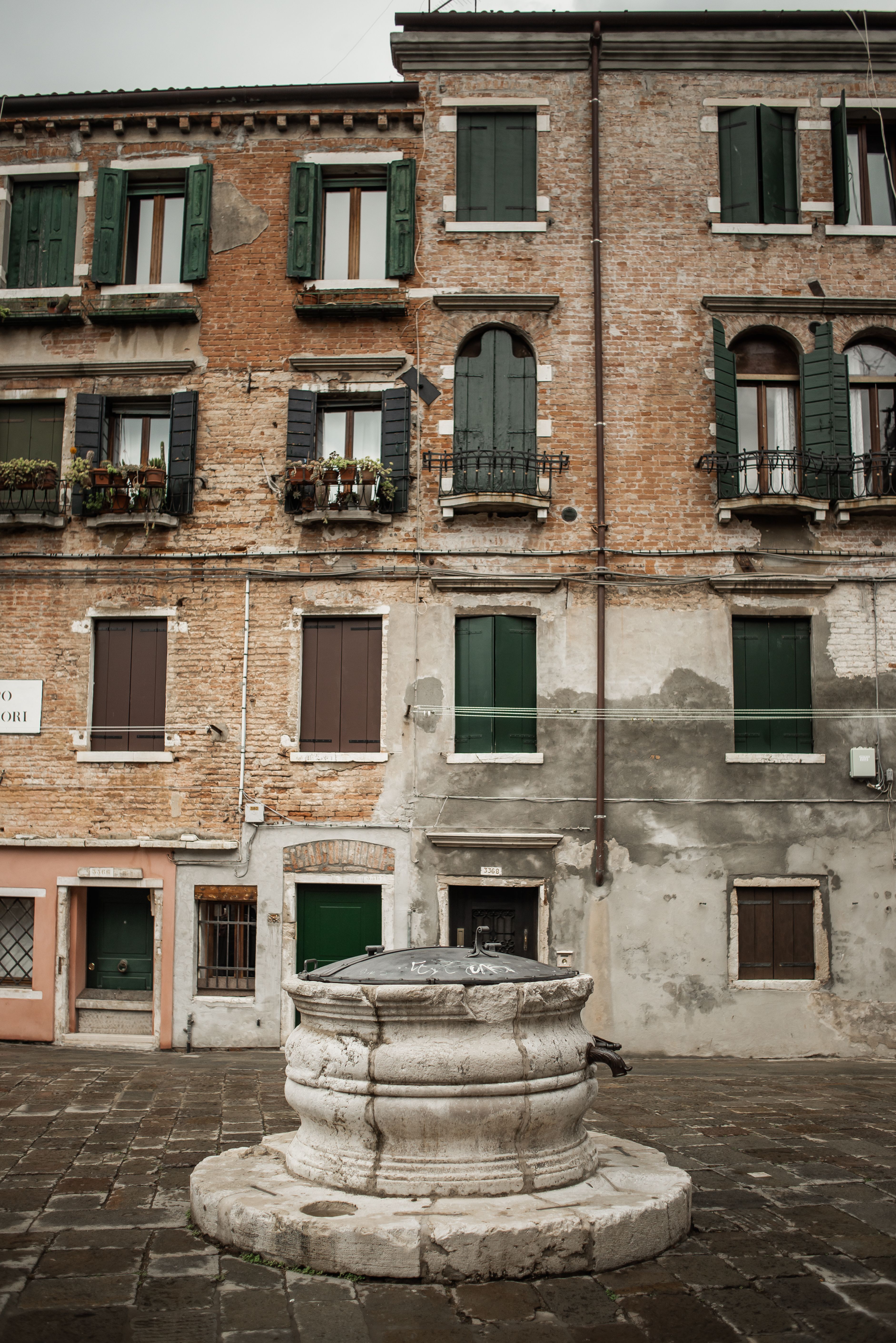Old city building on cobblestone street · Free Stock Photo