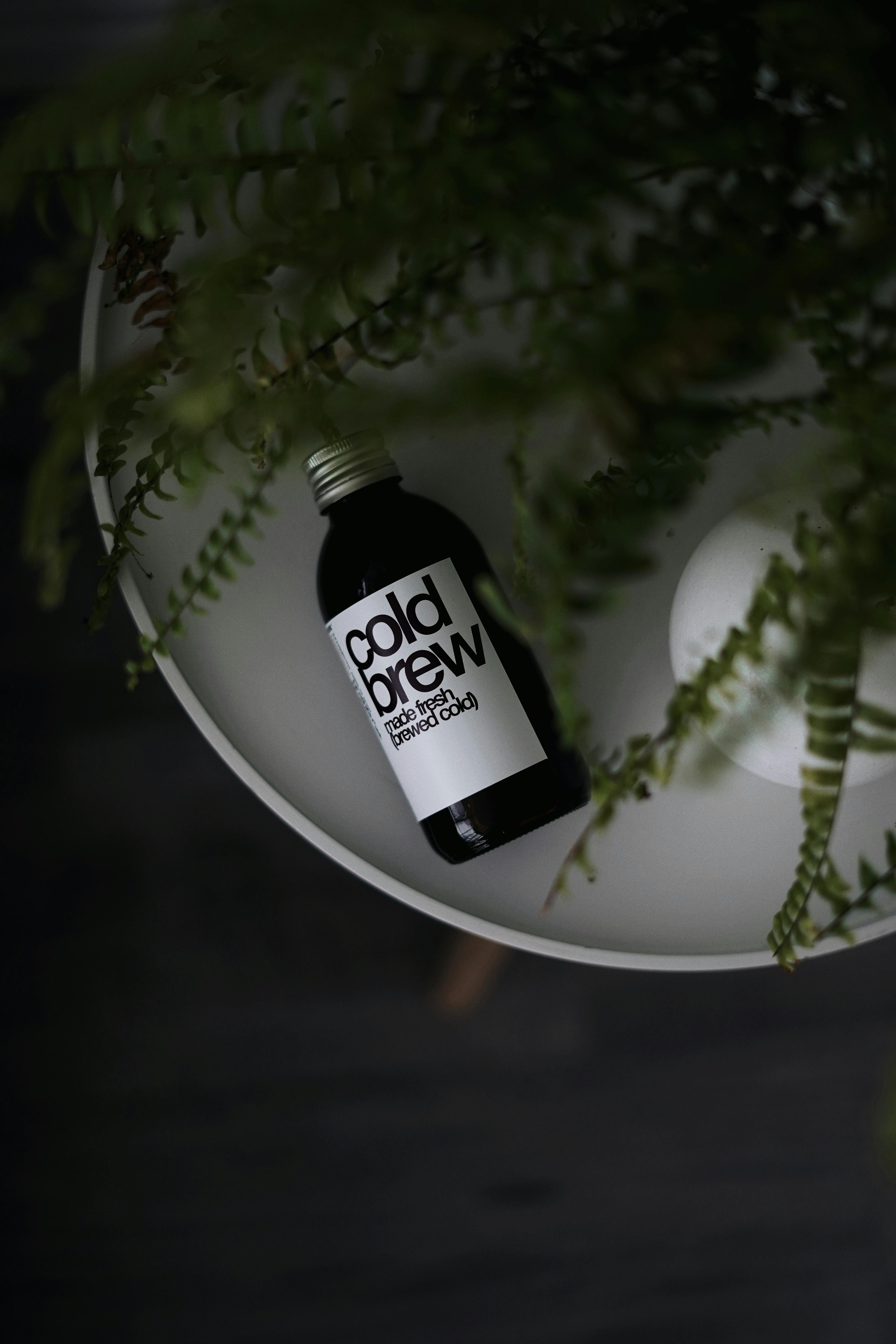 A Black and White Labeled Bottle · Free Stock Photo
