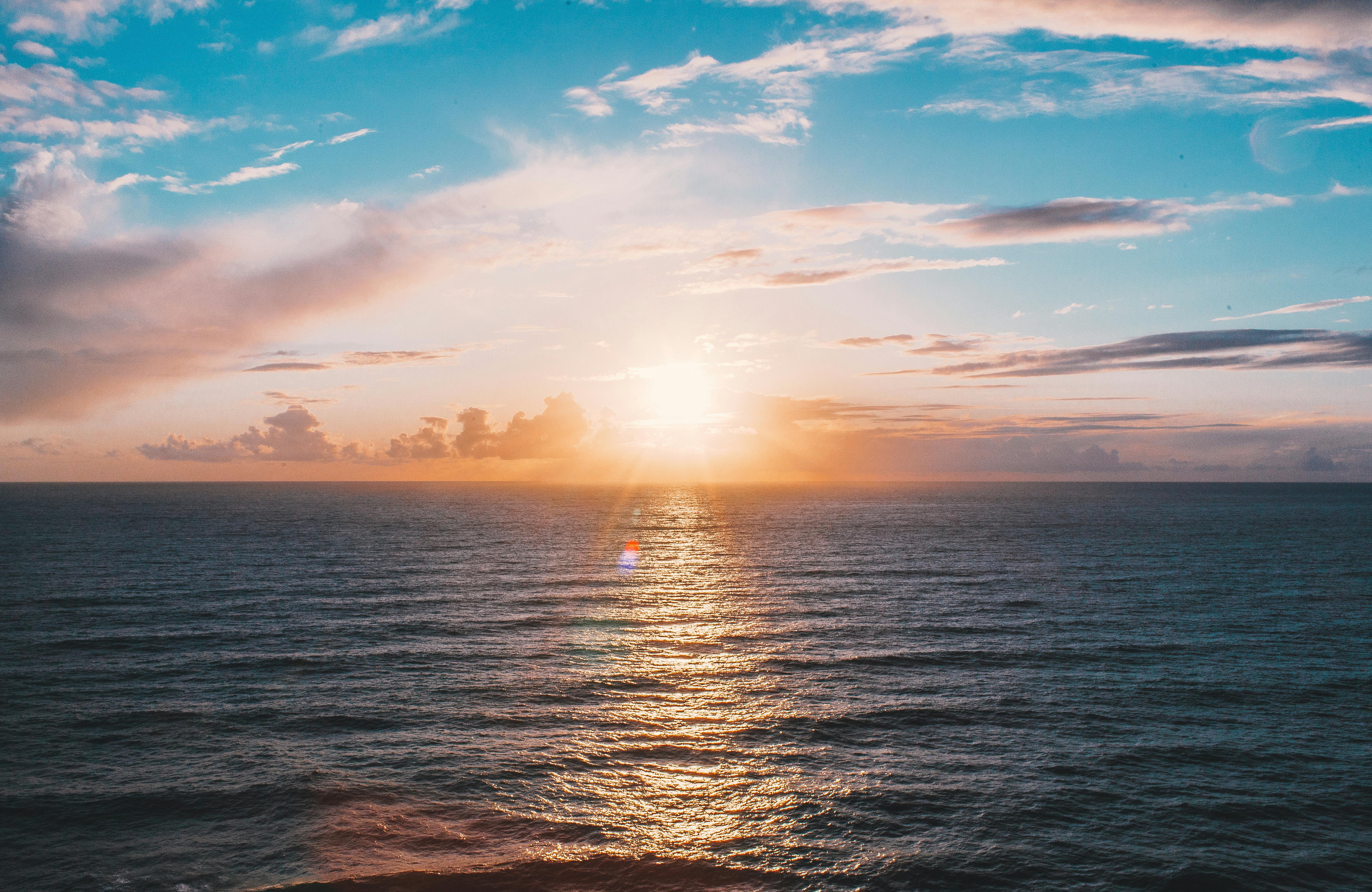 Rock Formation on Sea during Dawn · Free Stock Photo