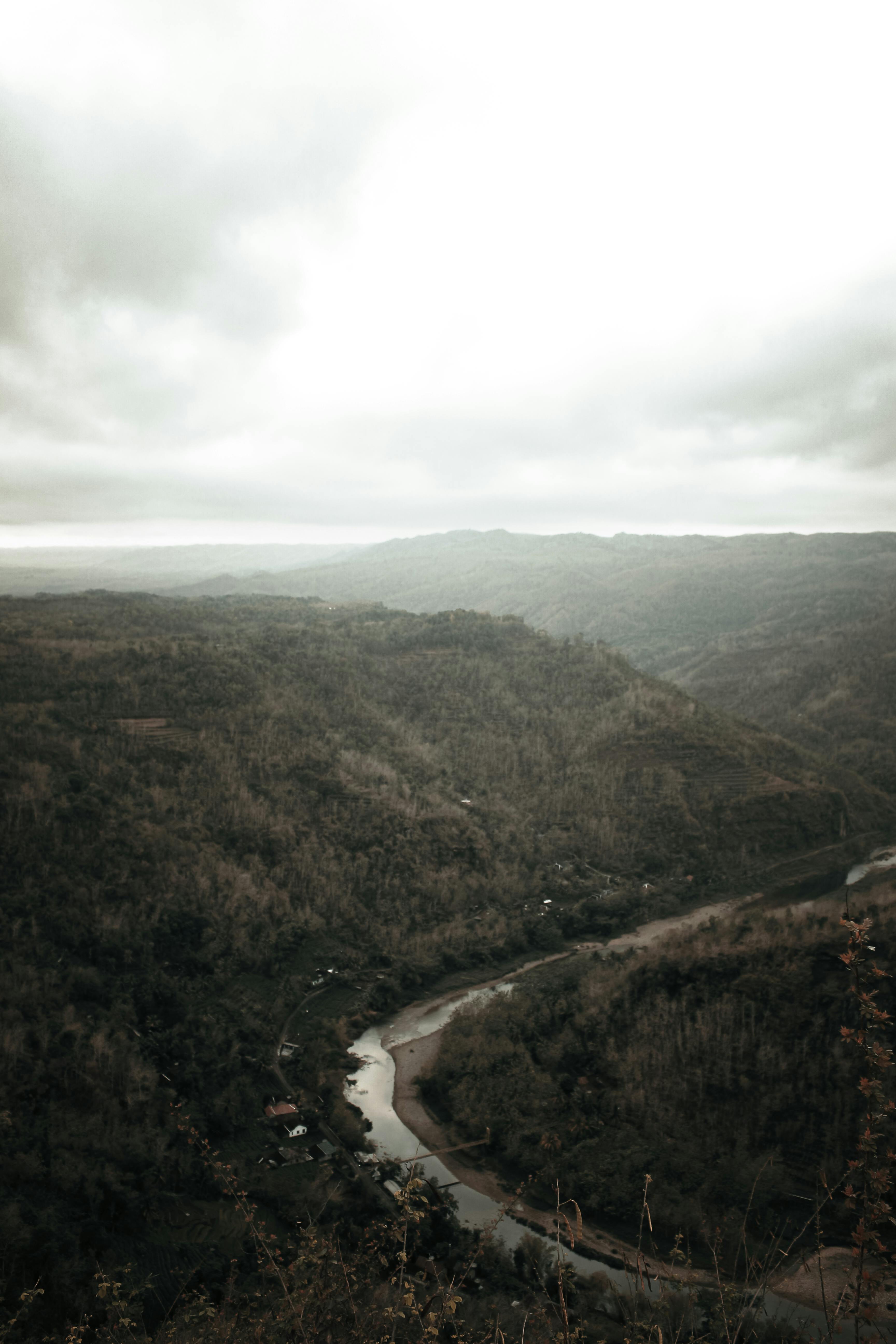 Overcast sky over mountains in countryside · Free Stock Photo