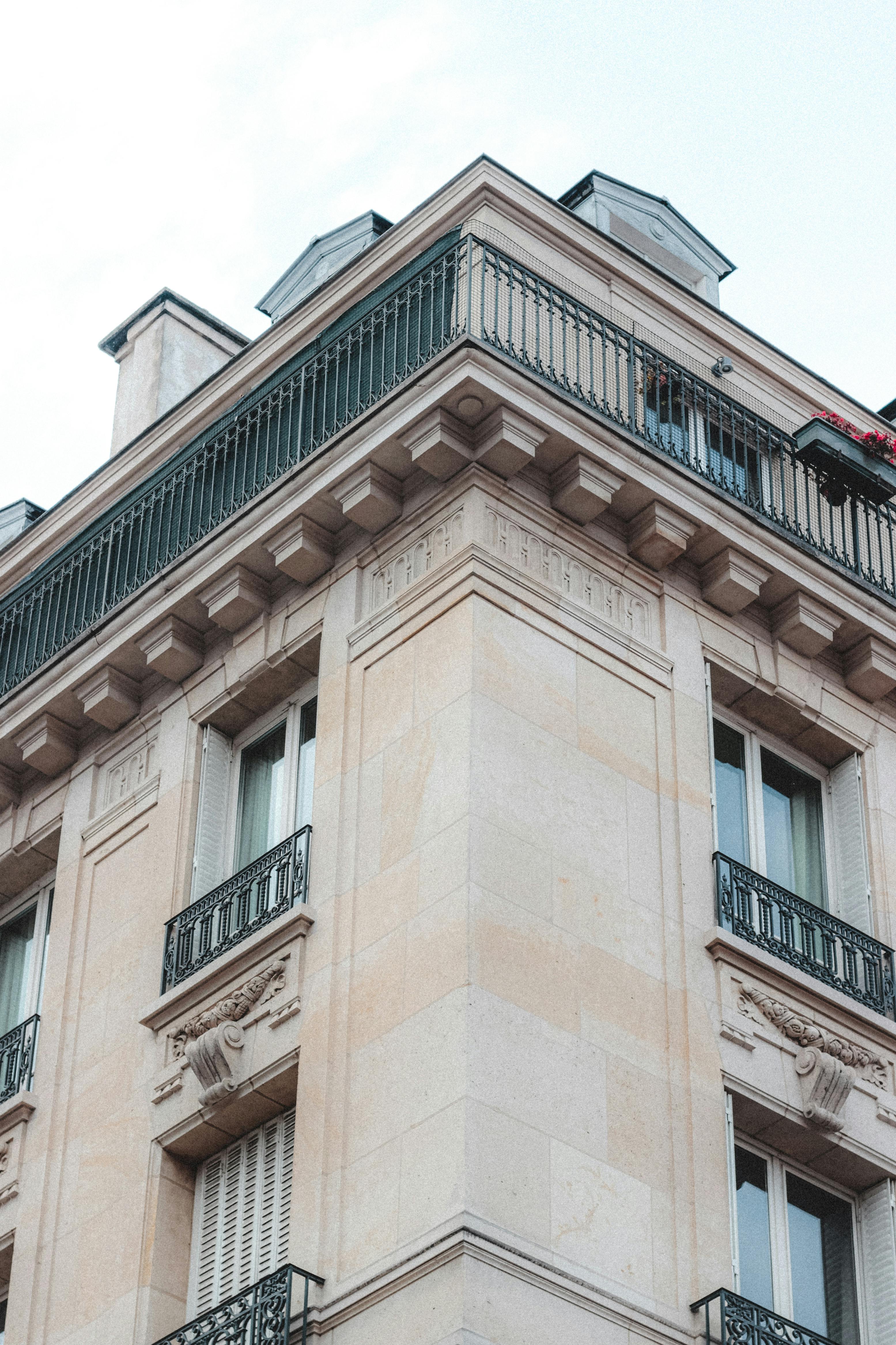 Old stone building with sculptures and balcony · Free Stock Photo