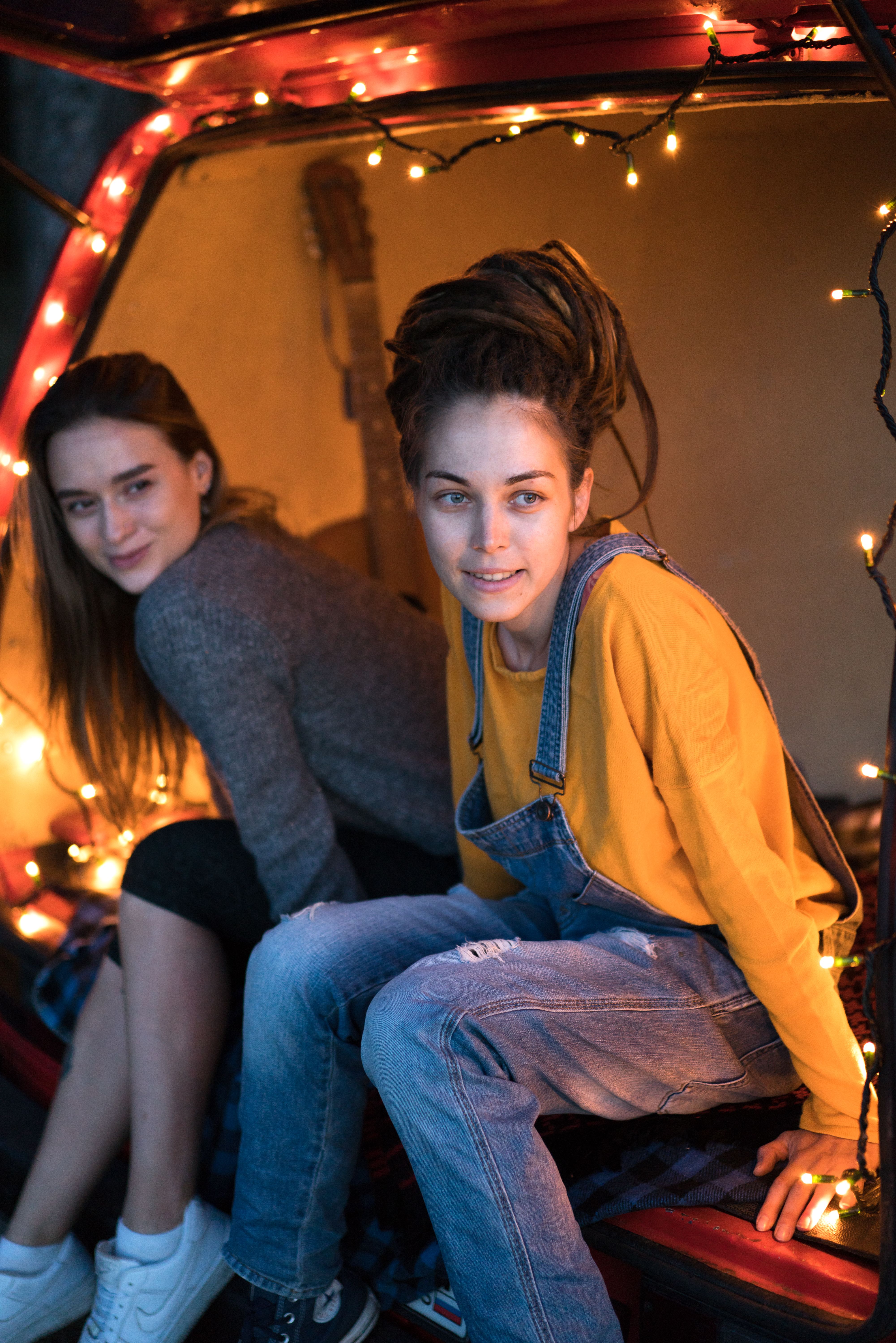 Portrait of Two Women Sitting Down · Free Stock Photo