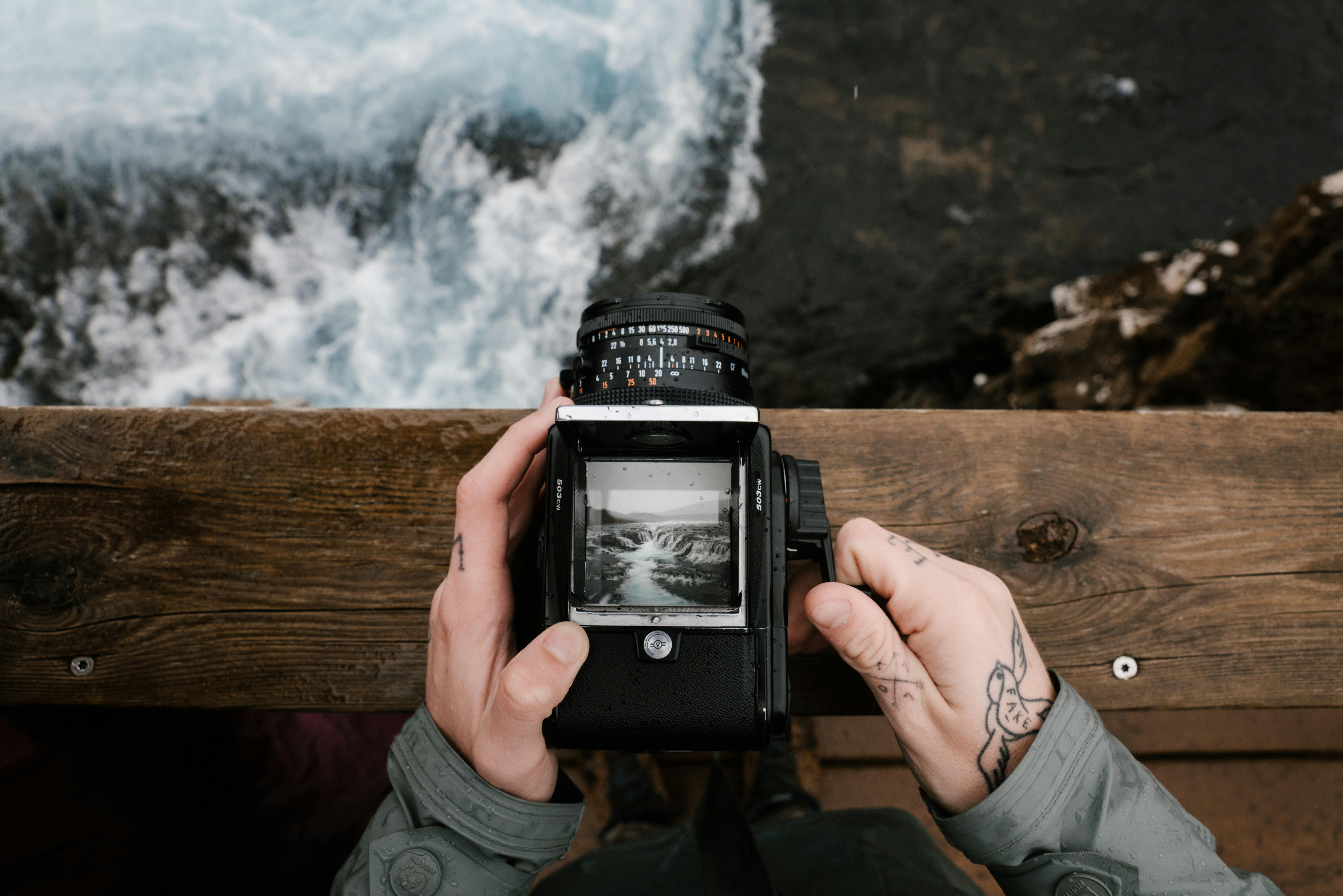 A Person Holding a Camera · Free Stock Photo