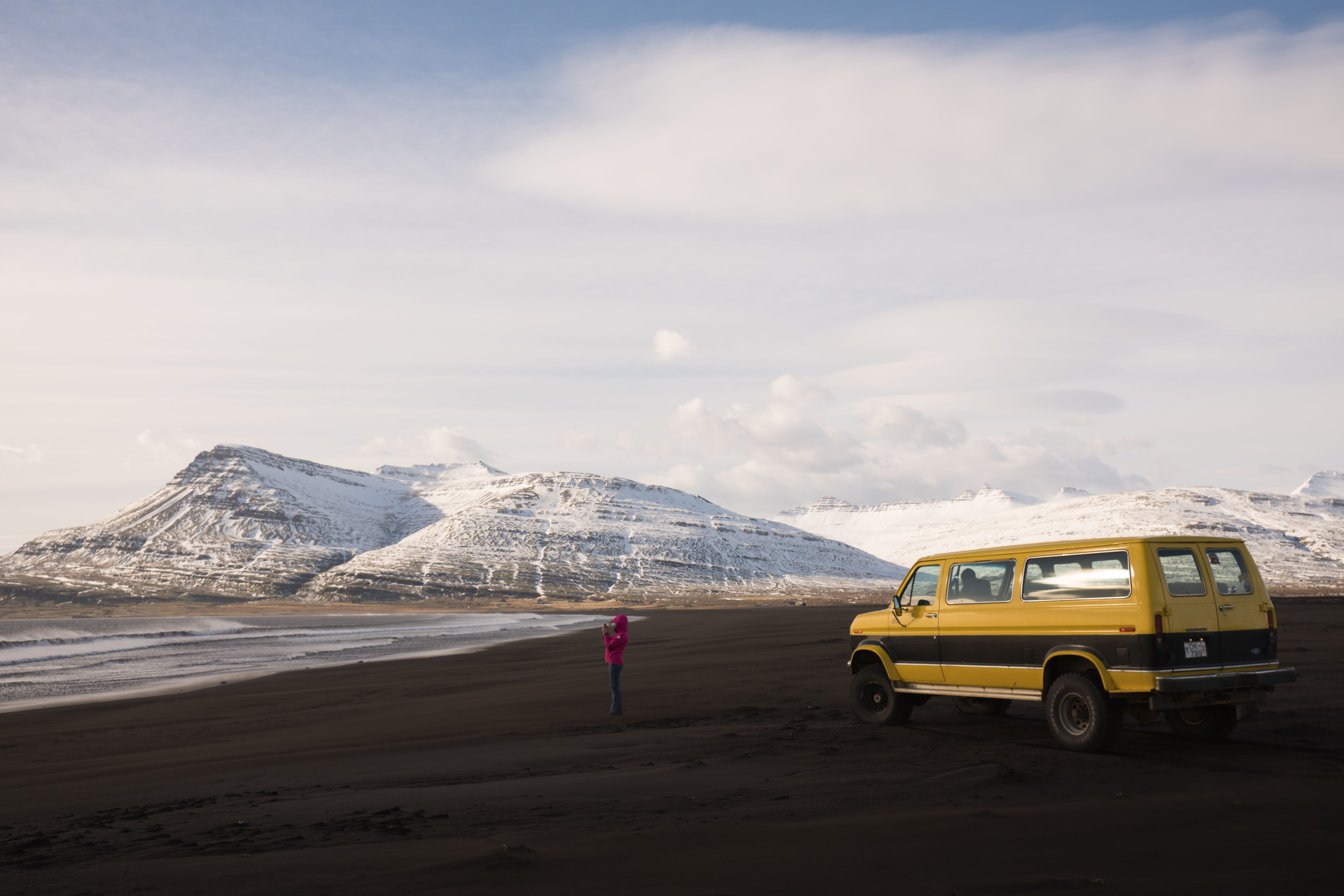 Scenic Landscape with a Yellow Car on a Beach · Free Stock Photo