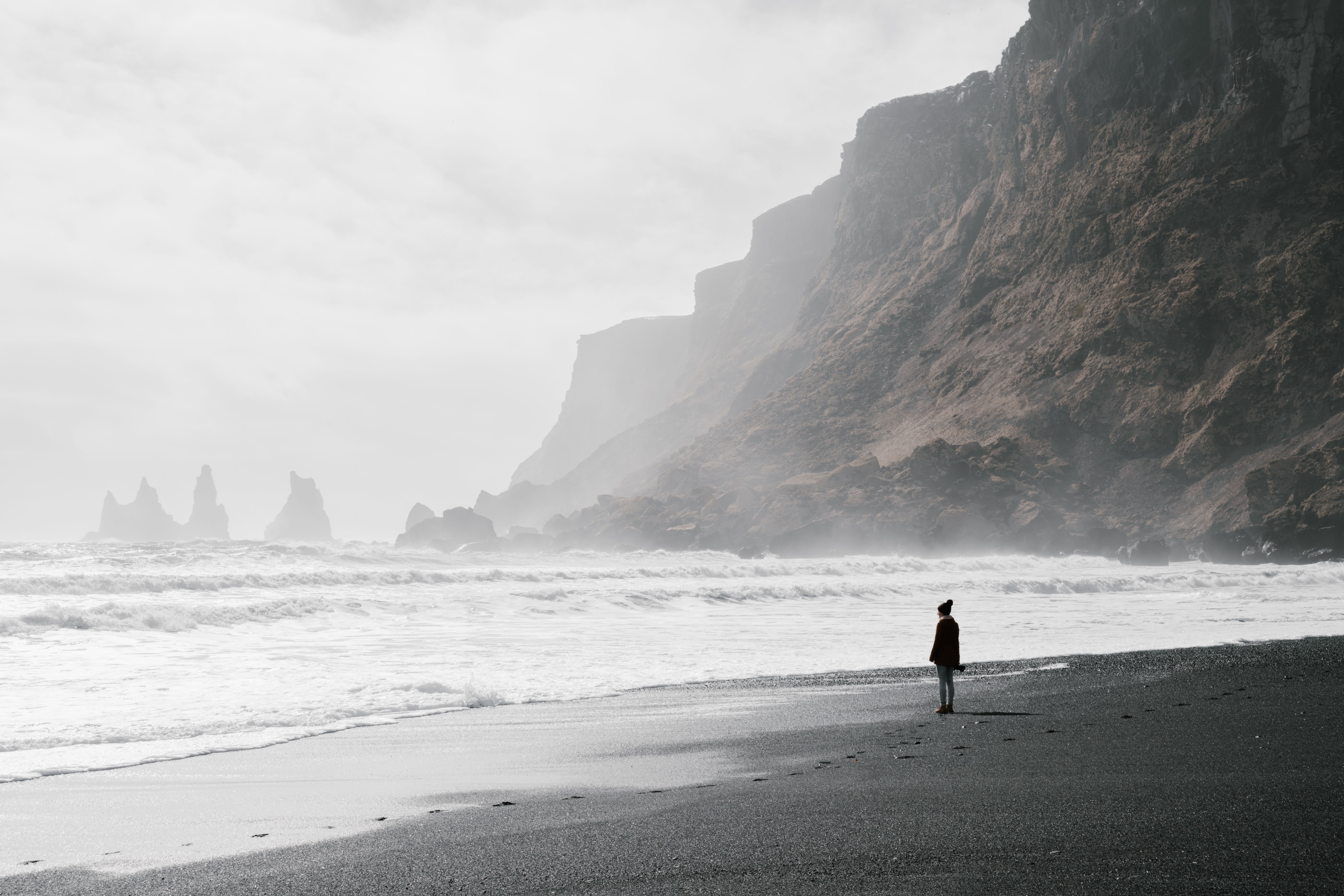 Photo of a Lone Person Standing on a Beach · Free Stock Photo