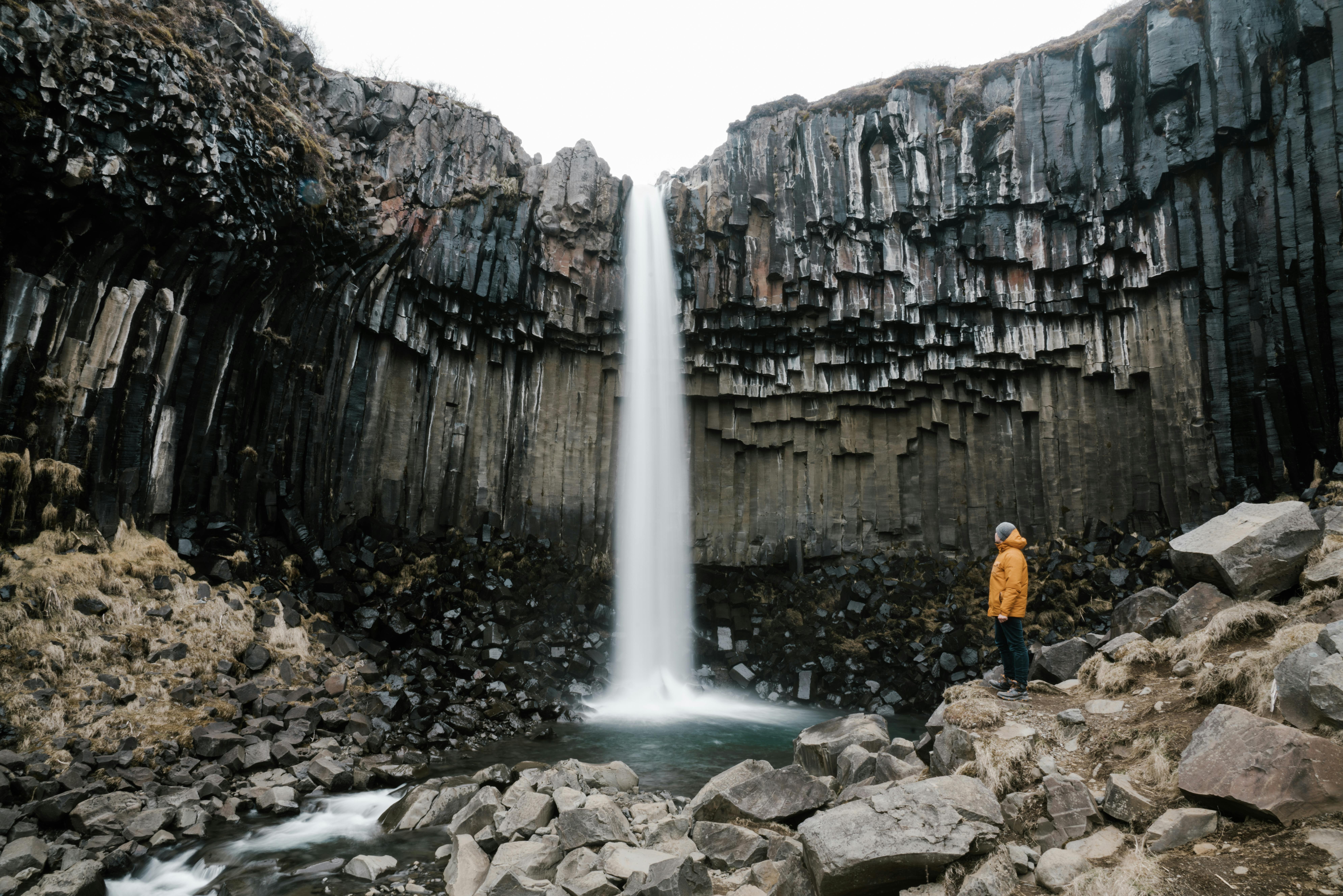 Man Looking At Waterfall · Free Stock Photo