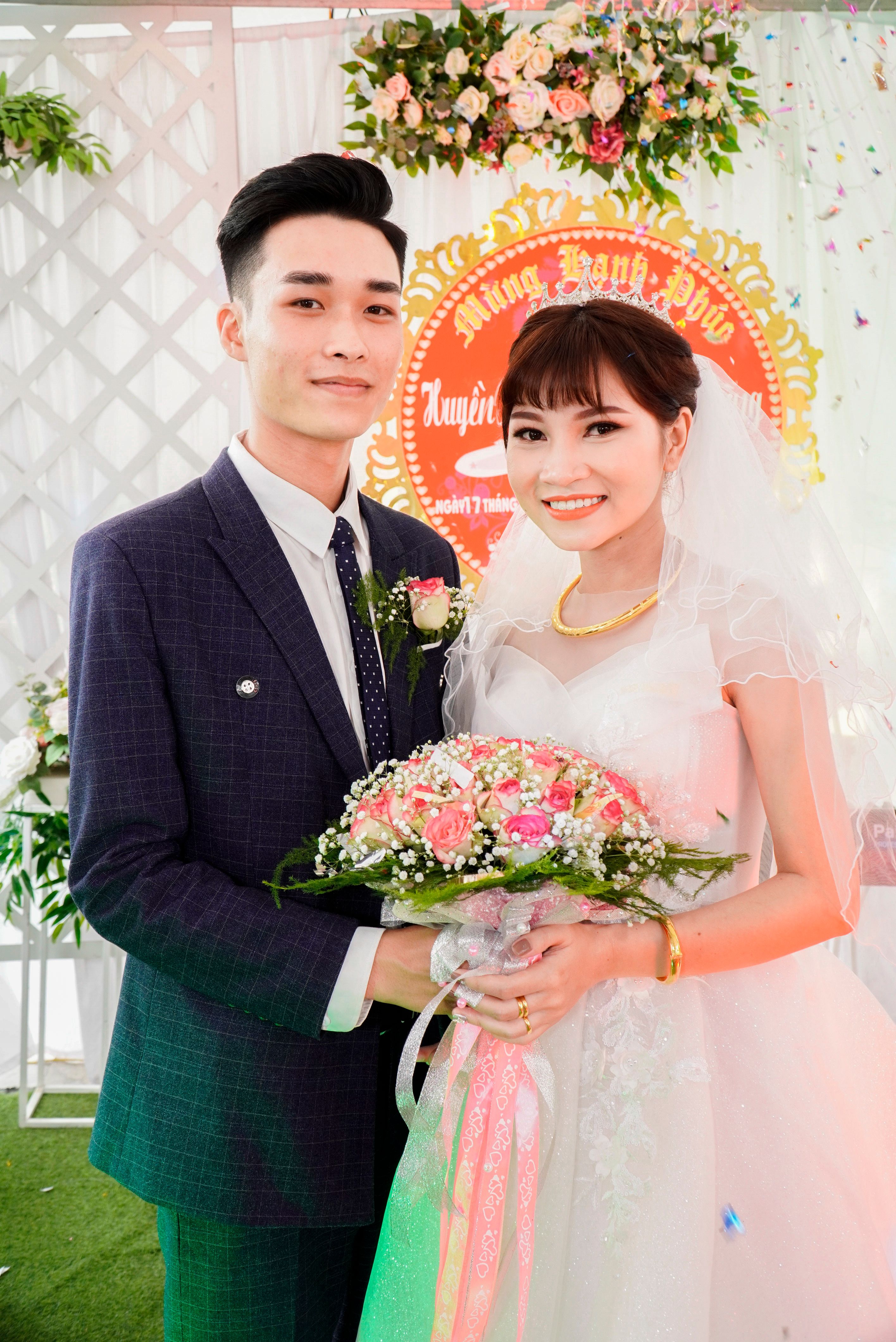 Cheerful ethnic newlyweds standing together during wedding party · Free ...