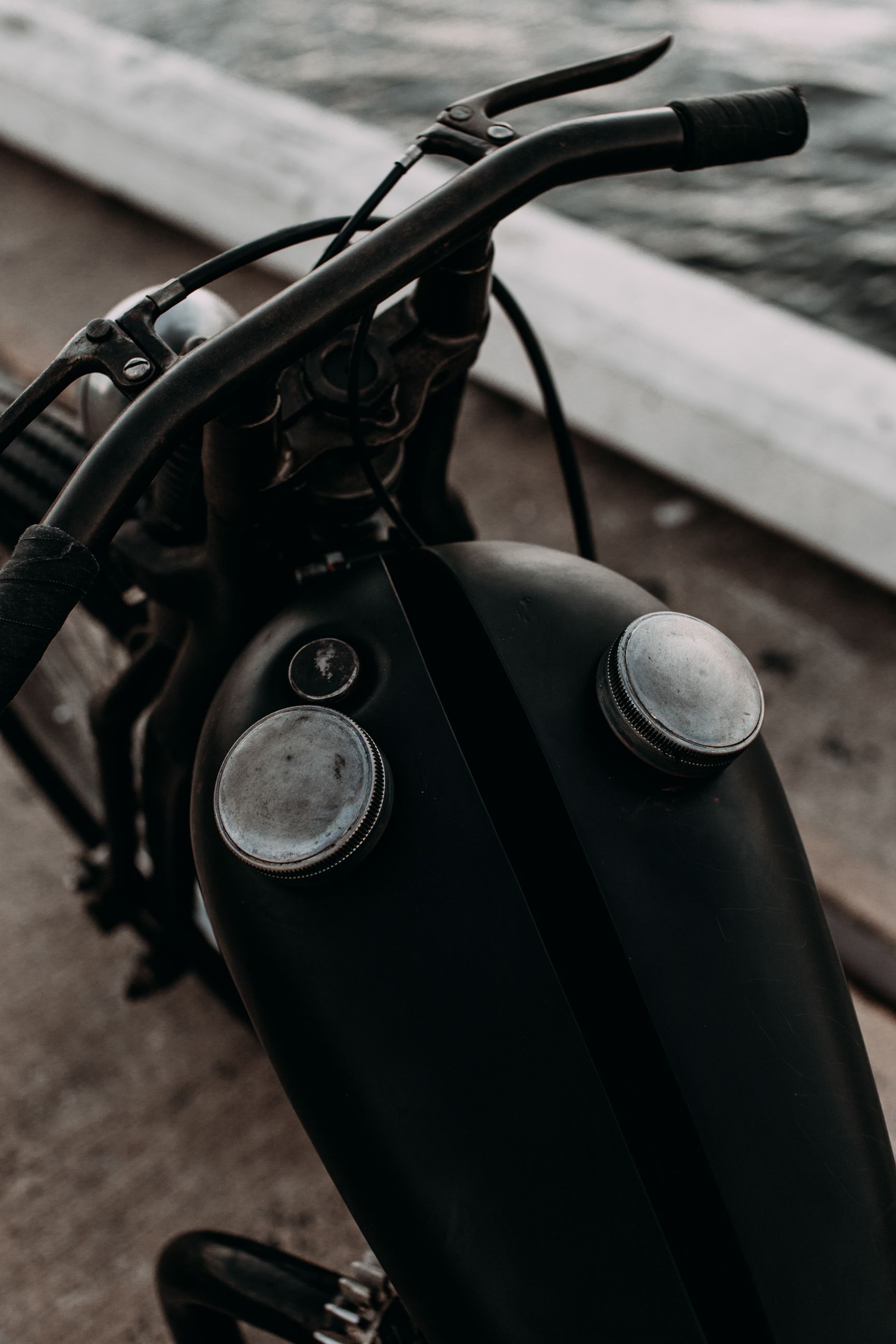 Headlight of motorcycle parked on pavement in daylight · Free Stock Photo