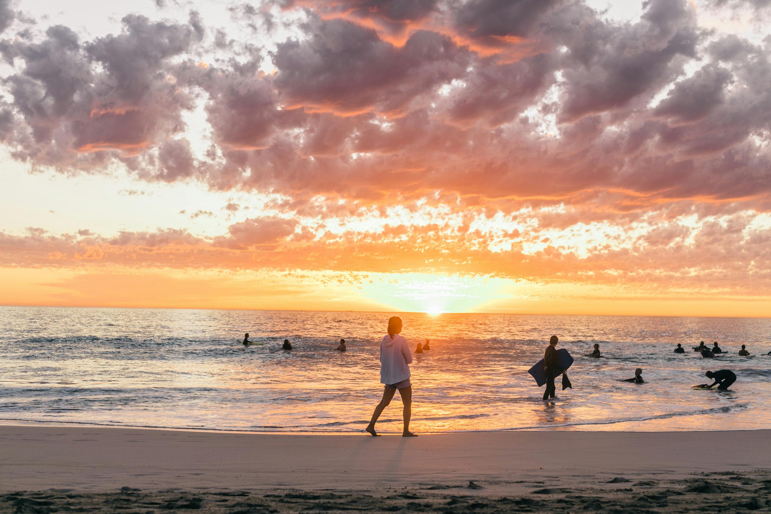 People having rest on beach at sunset · Free Stock Photo