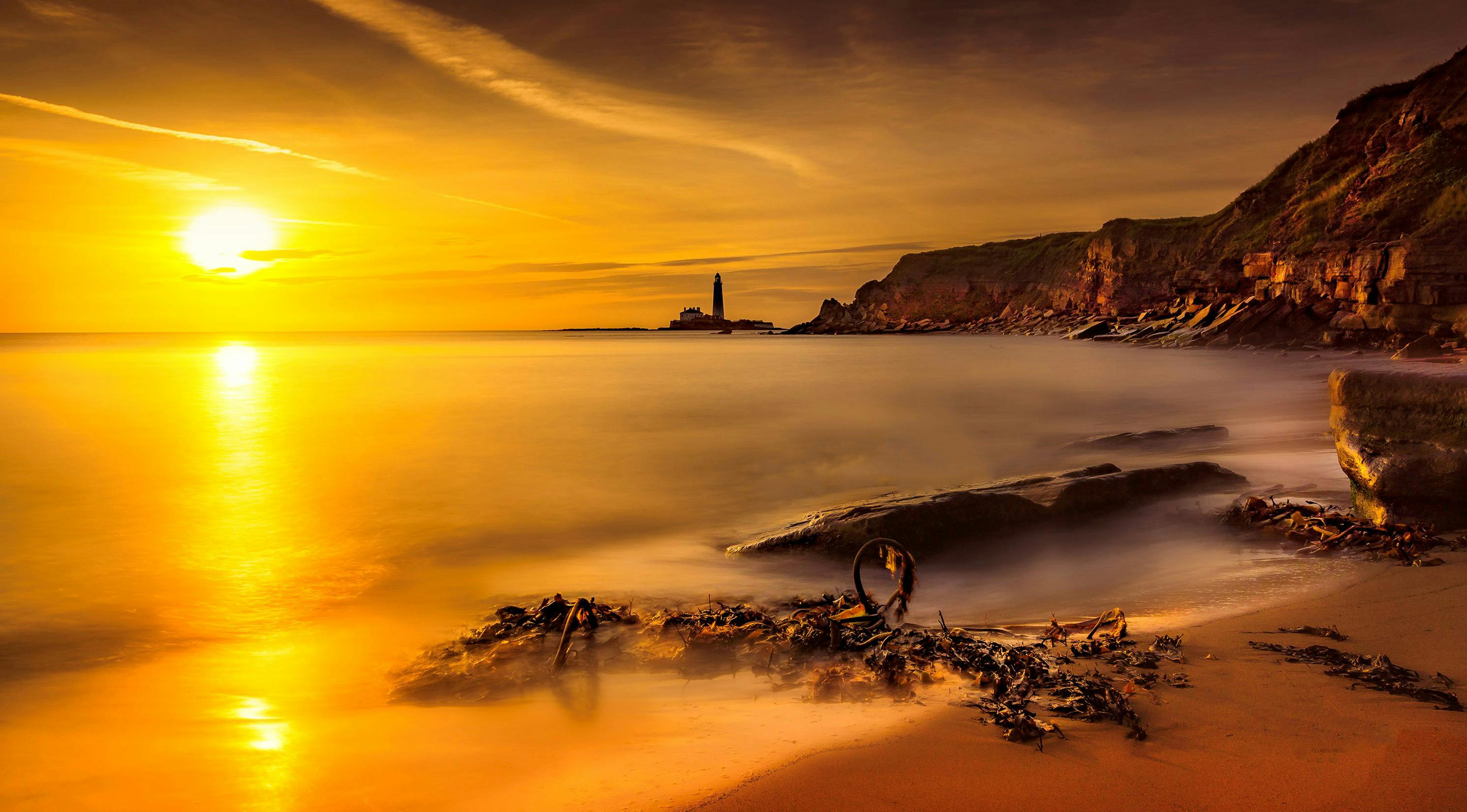 Bright sun illuminating foggy sea near mountain at sunset · Free Stock ...