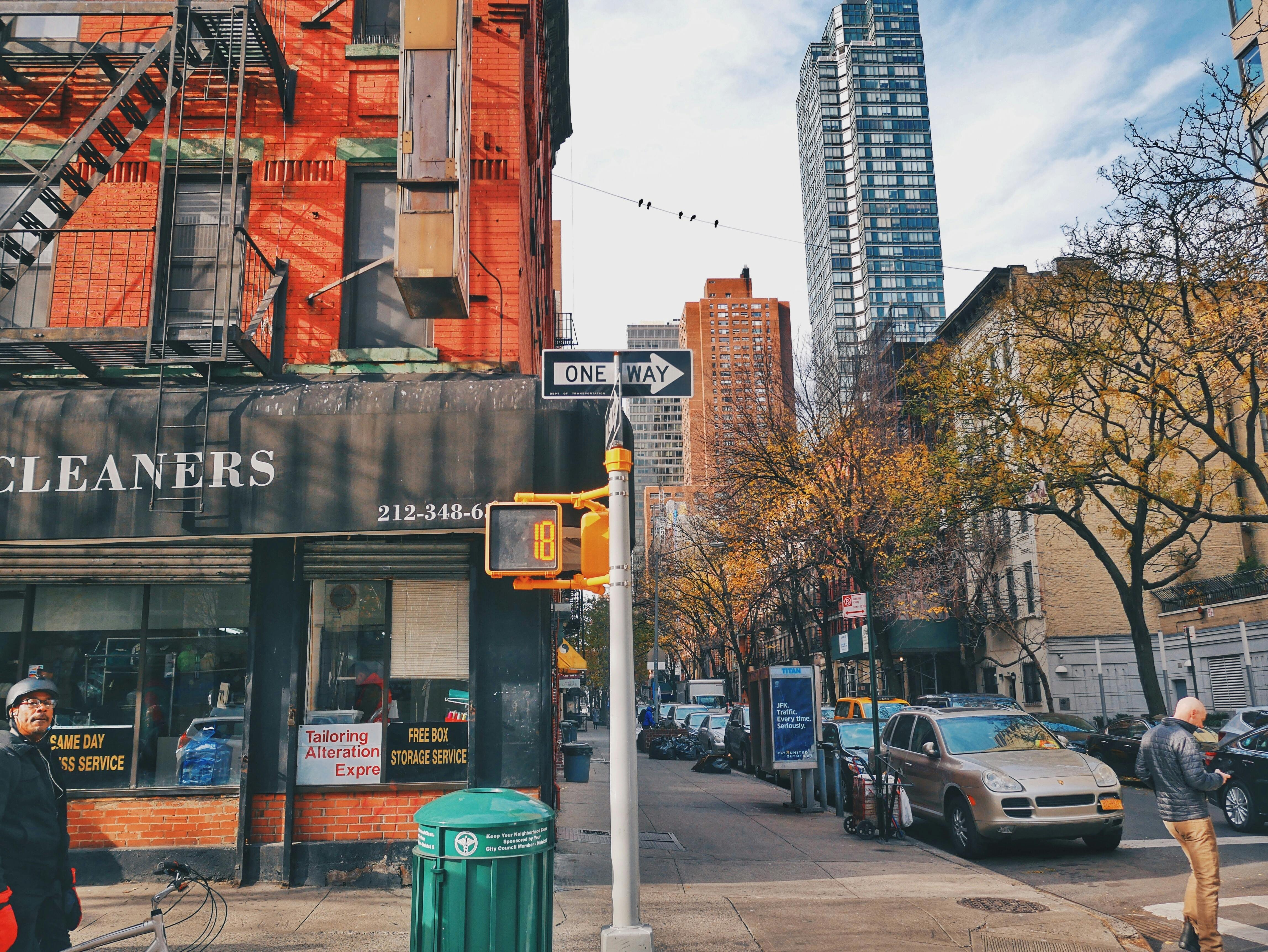 Cars Parked on Side of the Road Near Buildings · Free Stock Photo