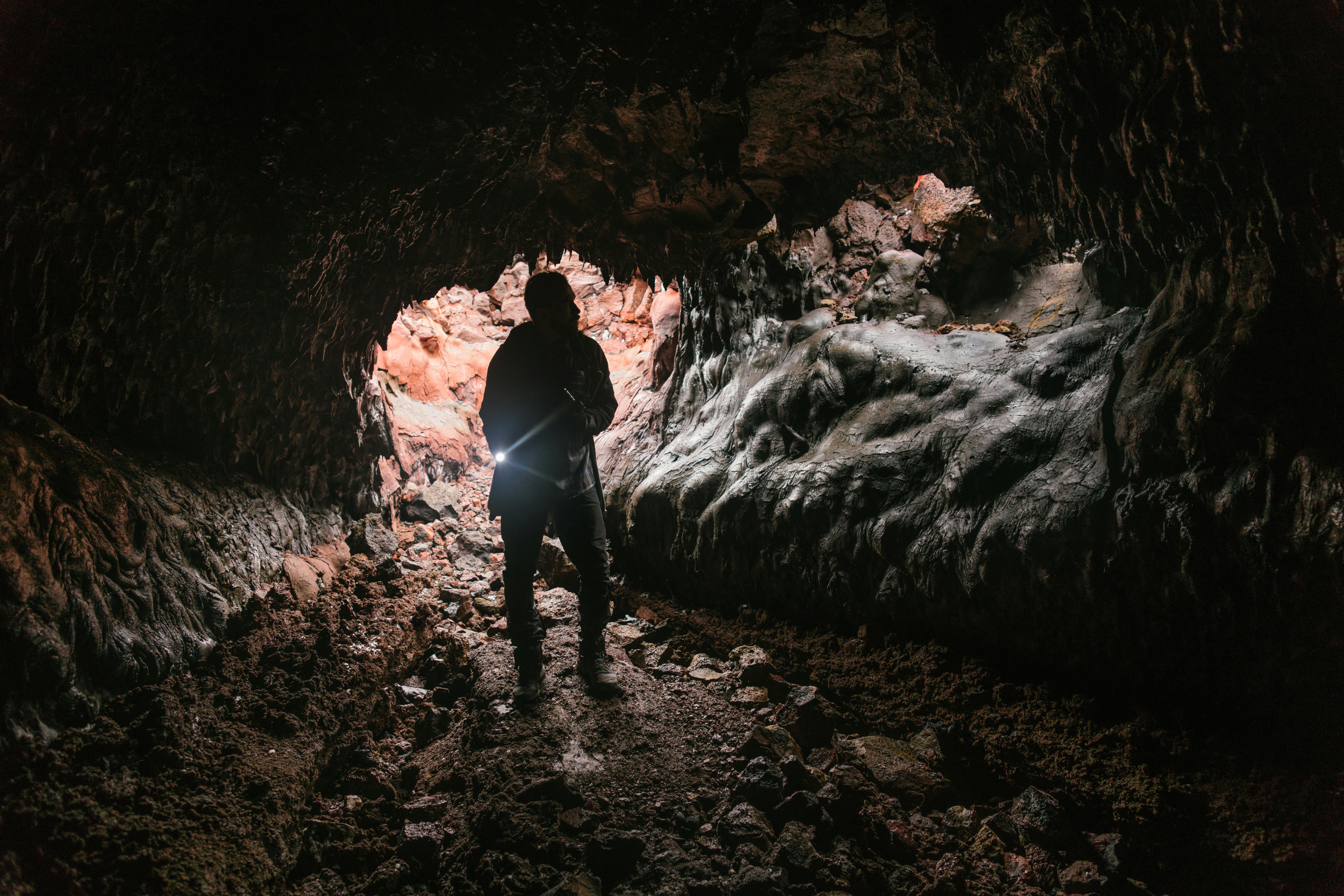 Person Exploring Cave · Free Stock Photo
