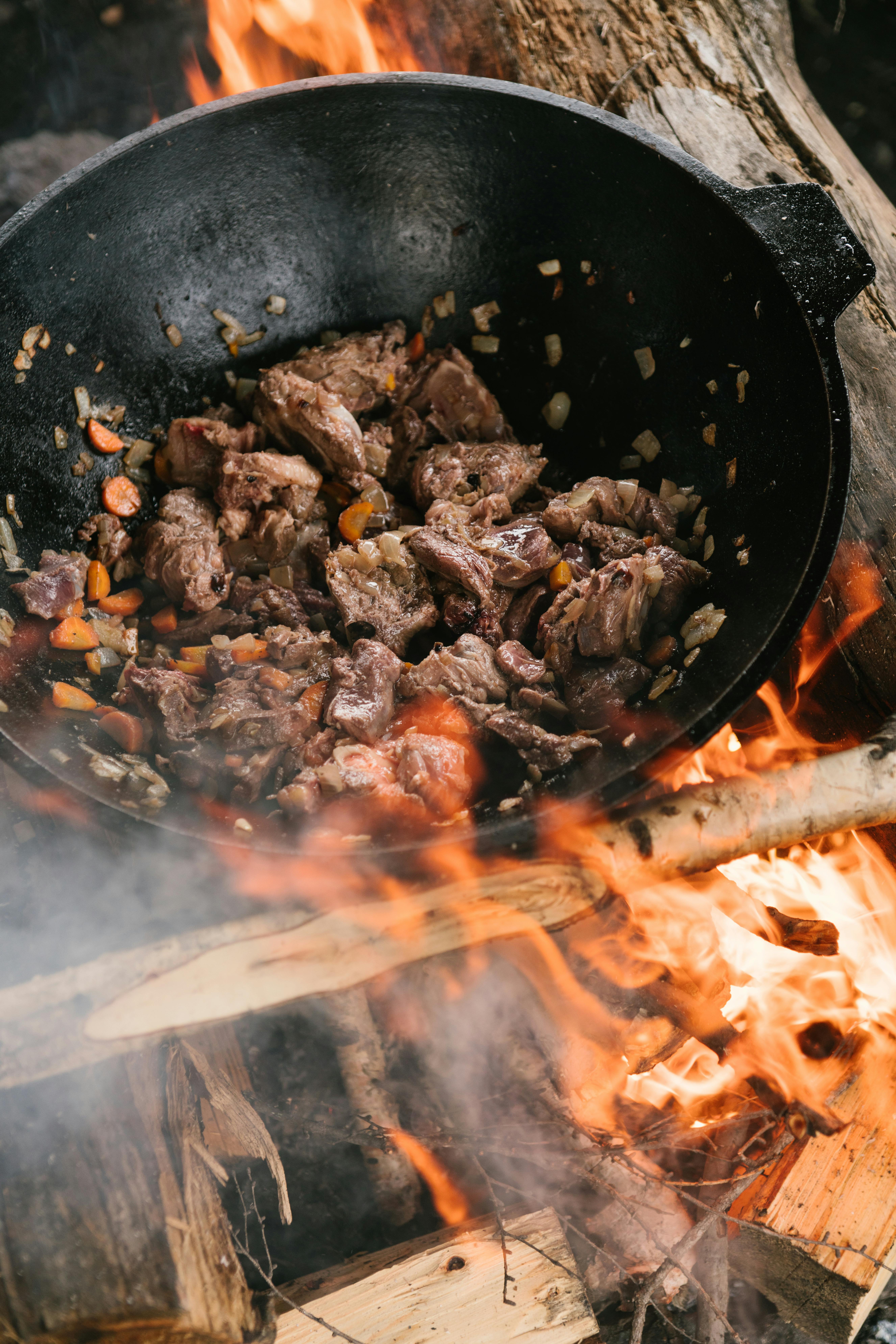 Close-Up Photo of Meat Cooking in Frying Pan · Free Stock Photo