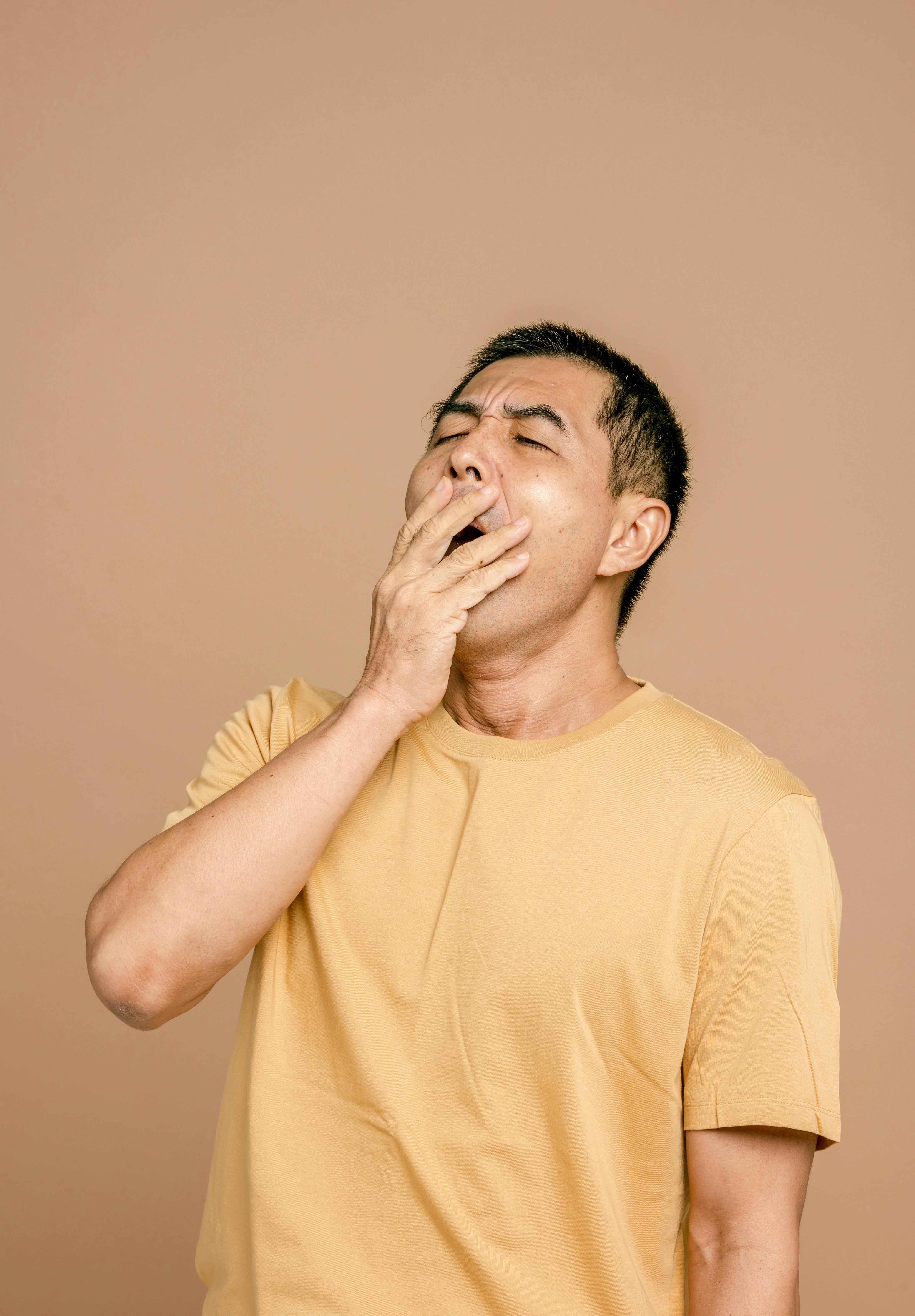 A Person Yawning With A Tired Expression Photos, Download The BEST Free ...