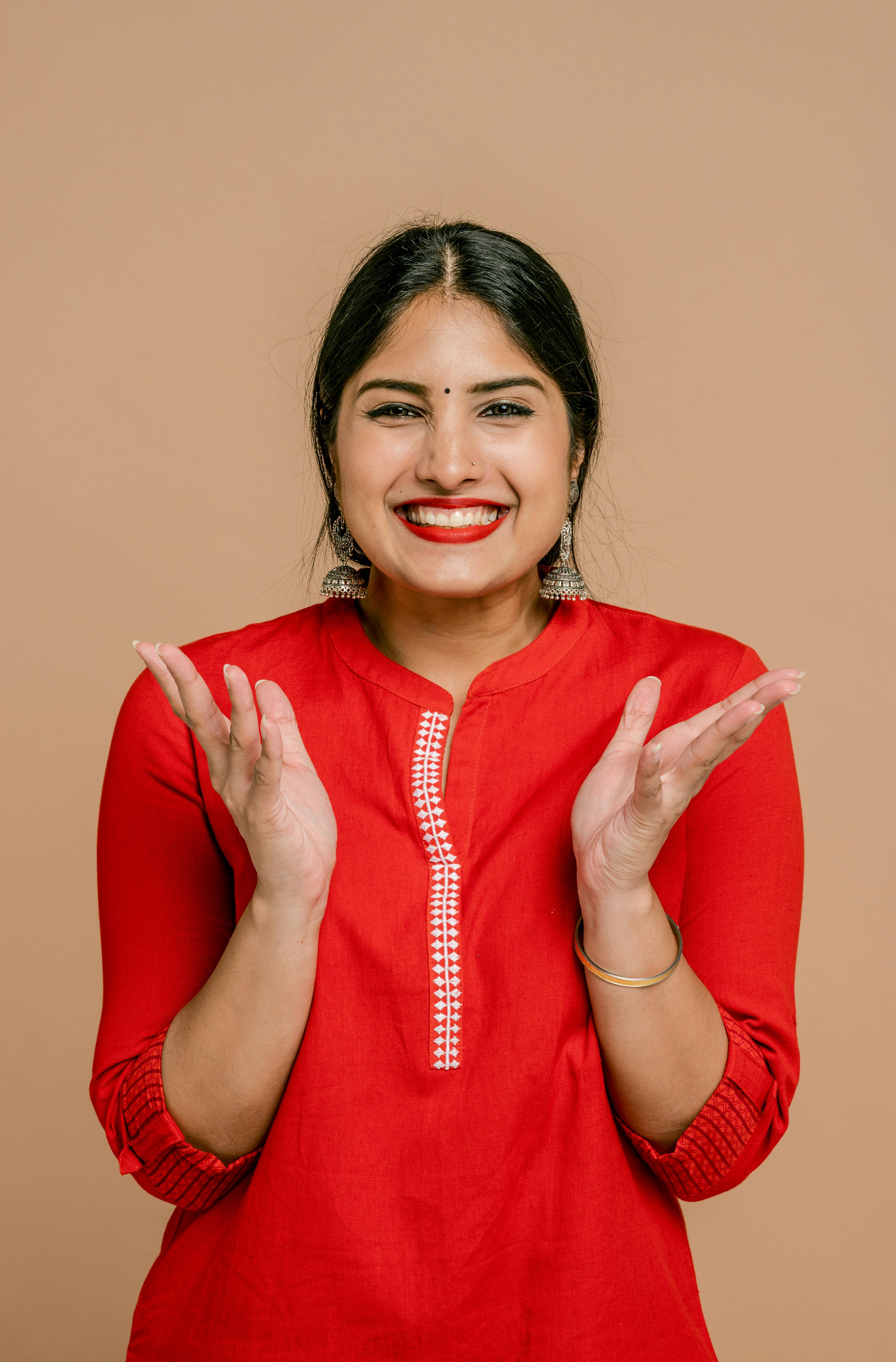 A Woman in Red Dress Smiling · Free Stock Photo