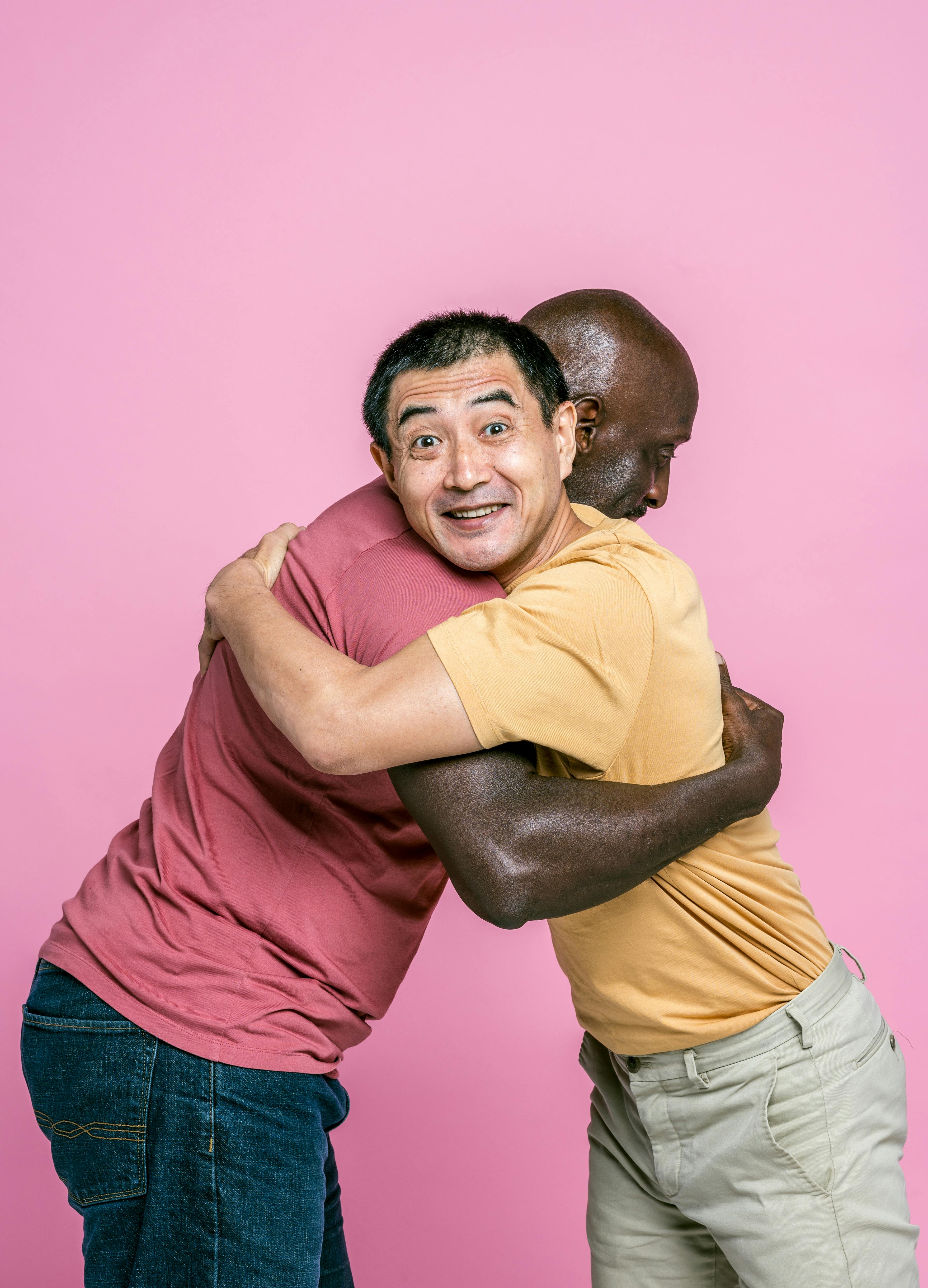 Two Men Embracing · Free Stock Photo