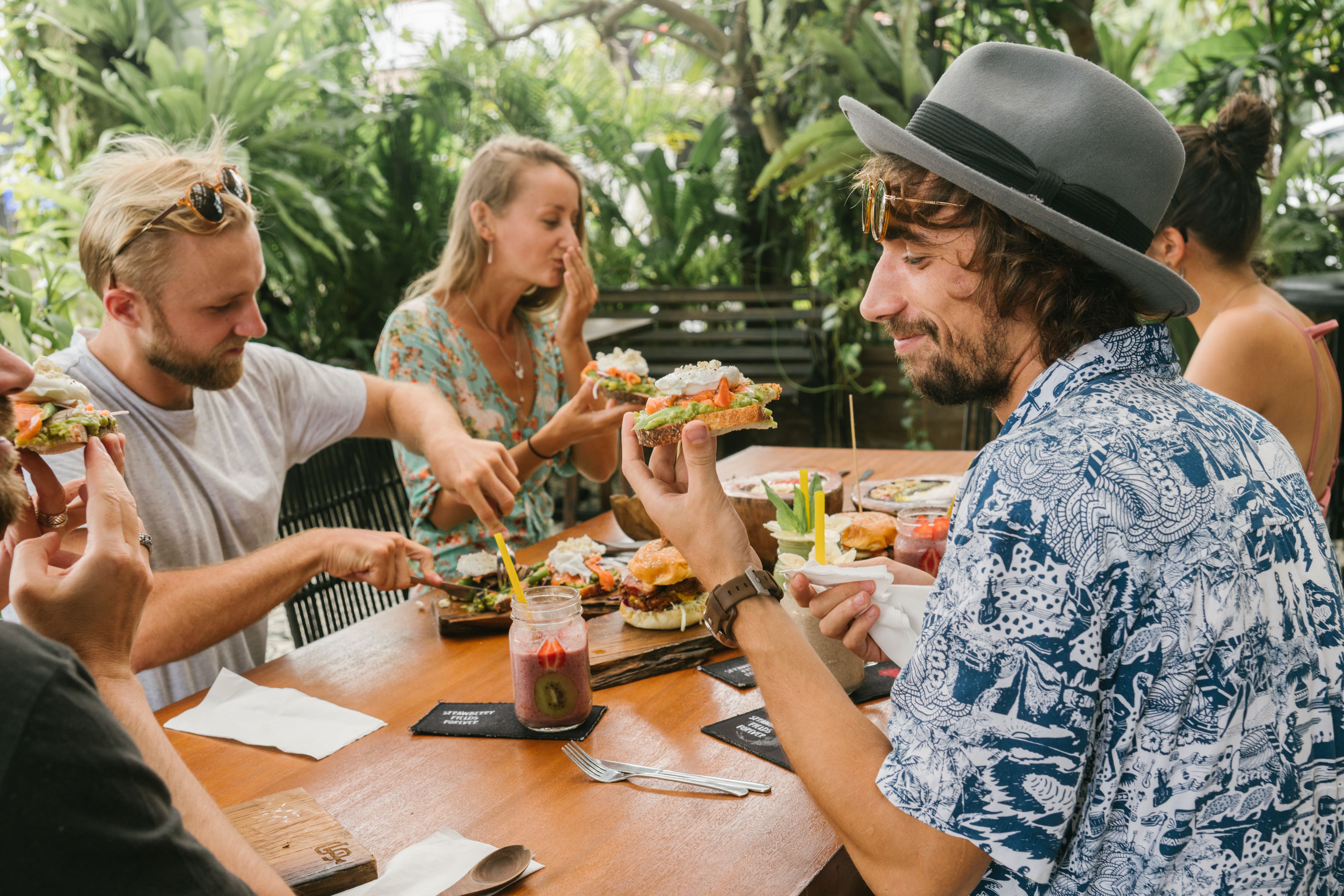 Group of People Eating Together at a Table · Free Stock Photo