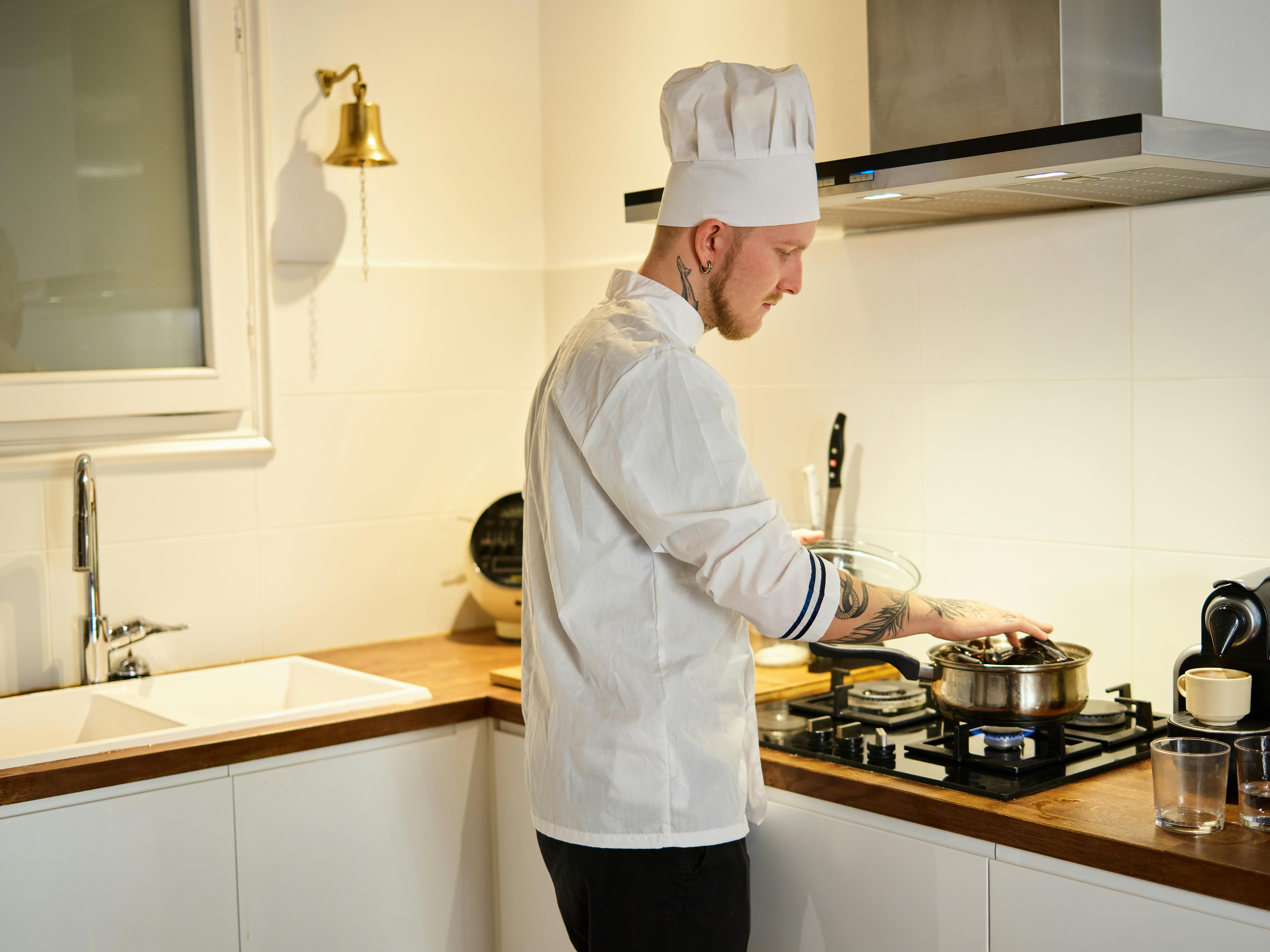 Man in White Chef Uniform Cooking · Free Stock Photo