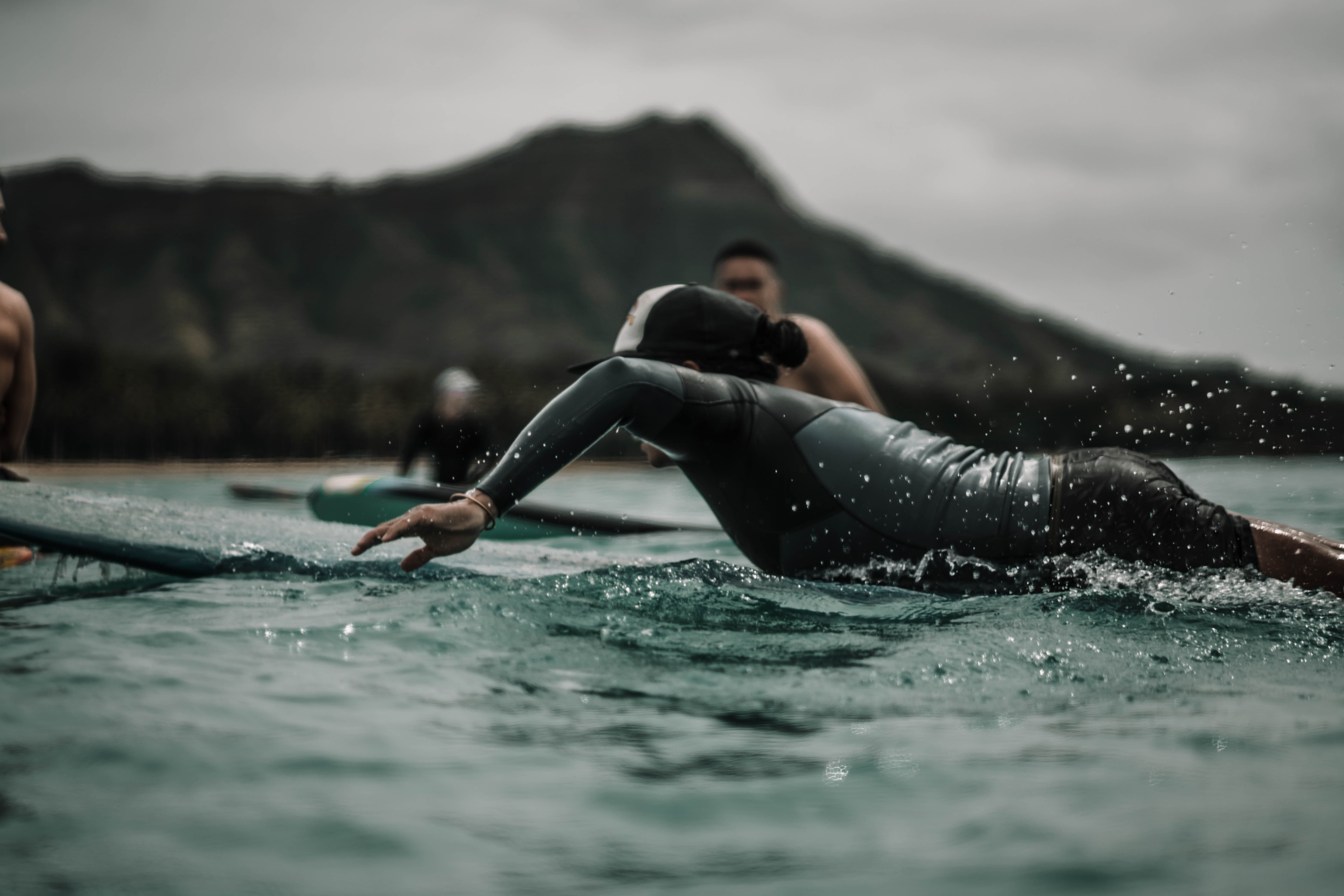 Man Wearing Blue Shorts Performing Back Flip over Body of Water · Free ...