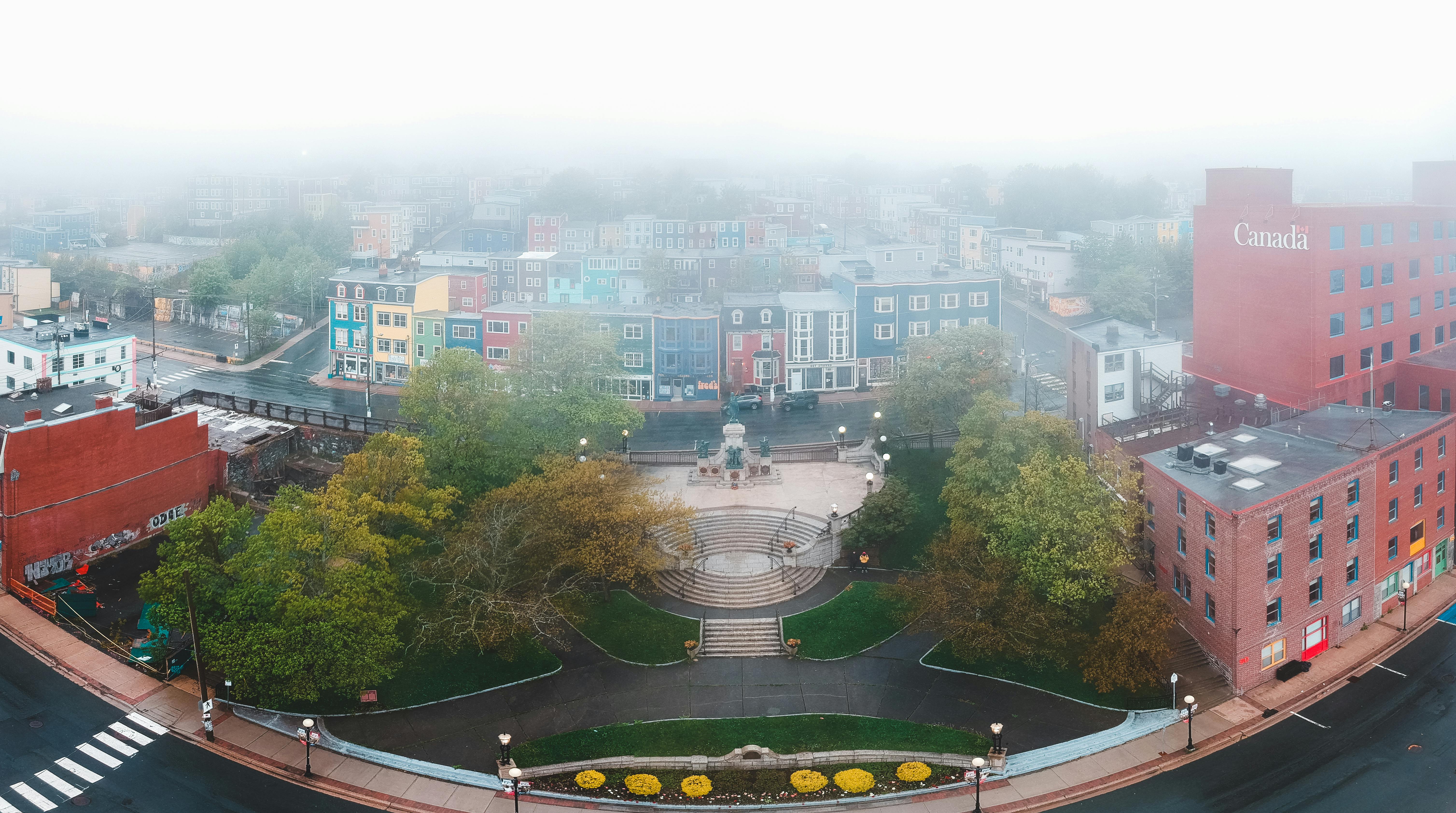 Cityscape with bright old house exteriors under foggy sky · Free Stock ...