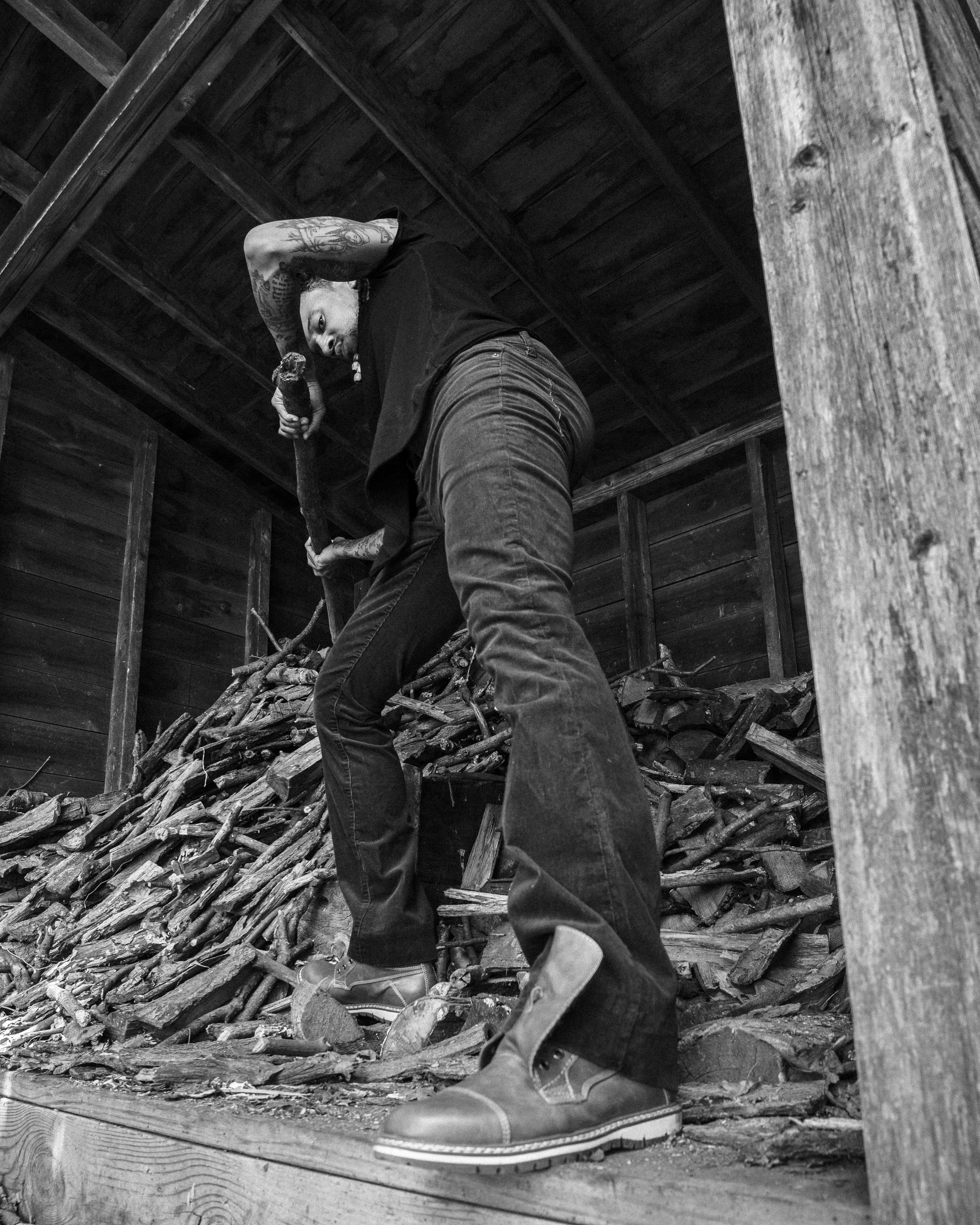Man Working Inside a Barn · Free Stock Photo