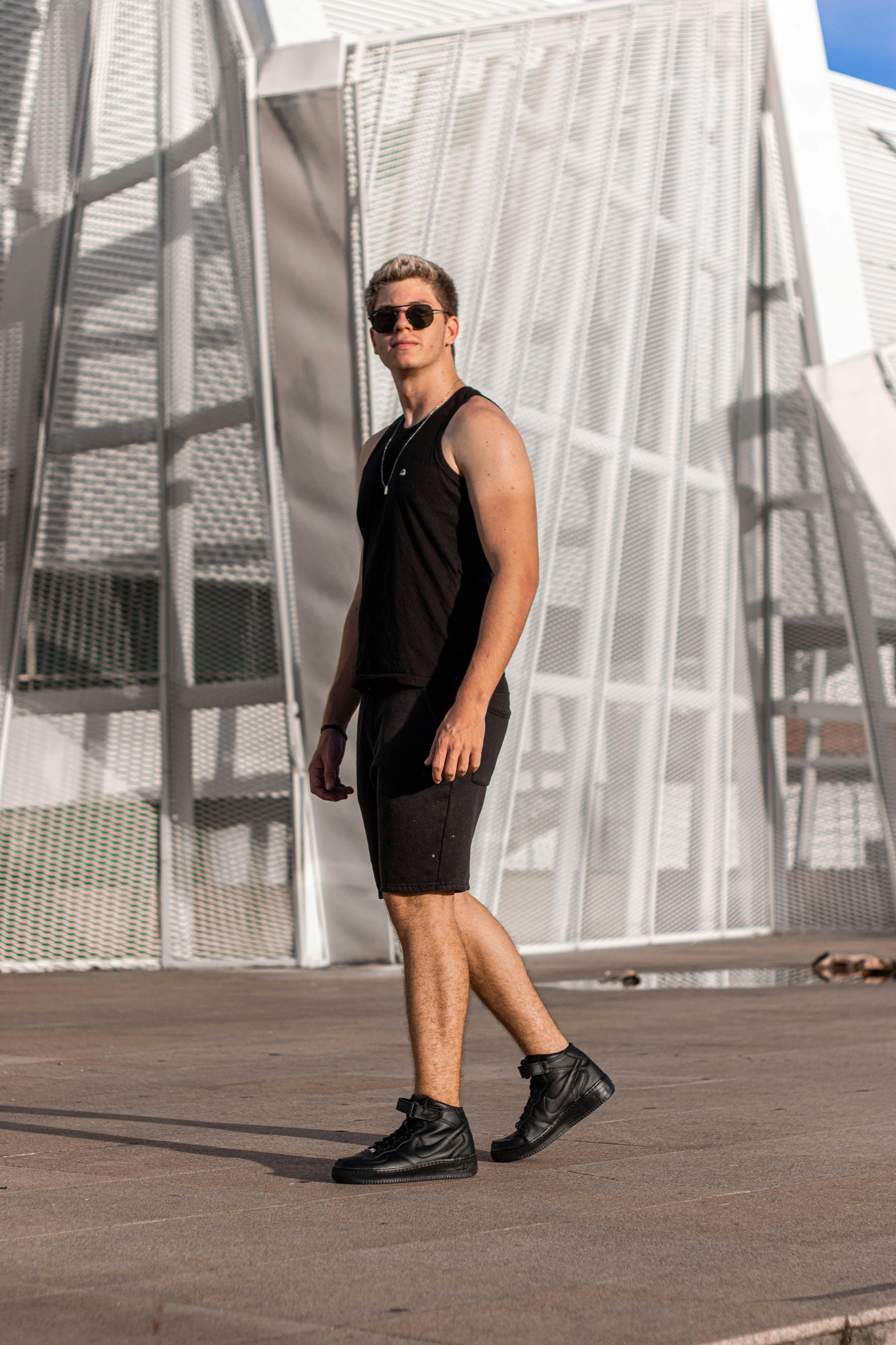 Stylish man standing on sidewalk · Free Stock Photo