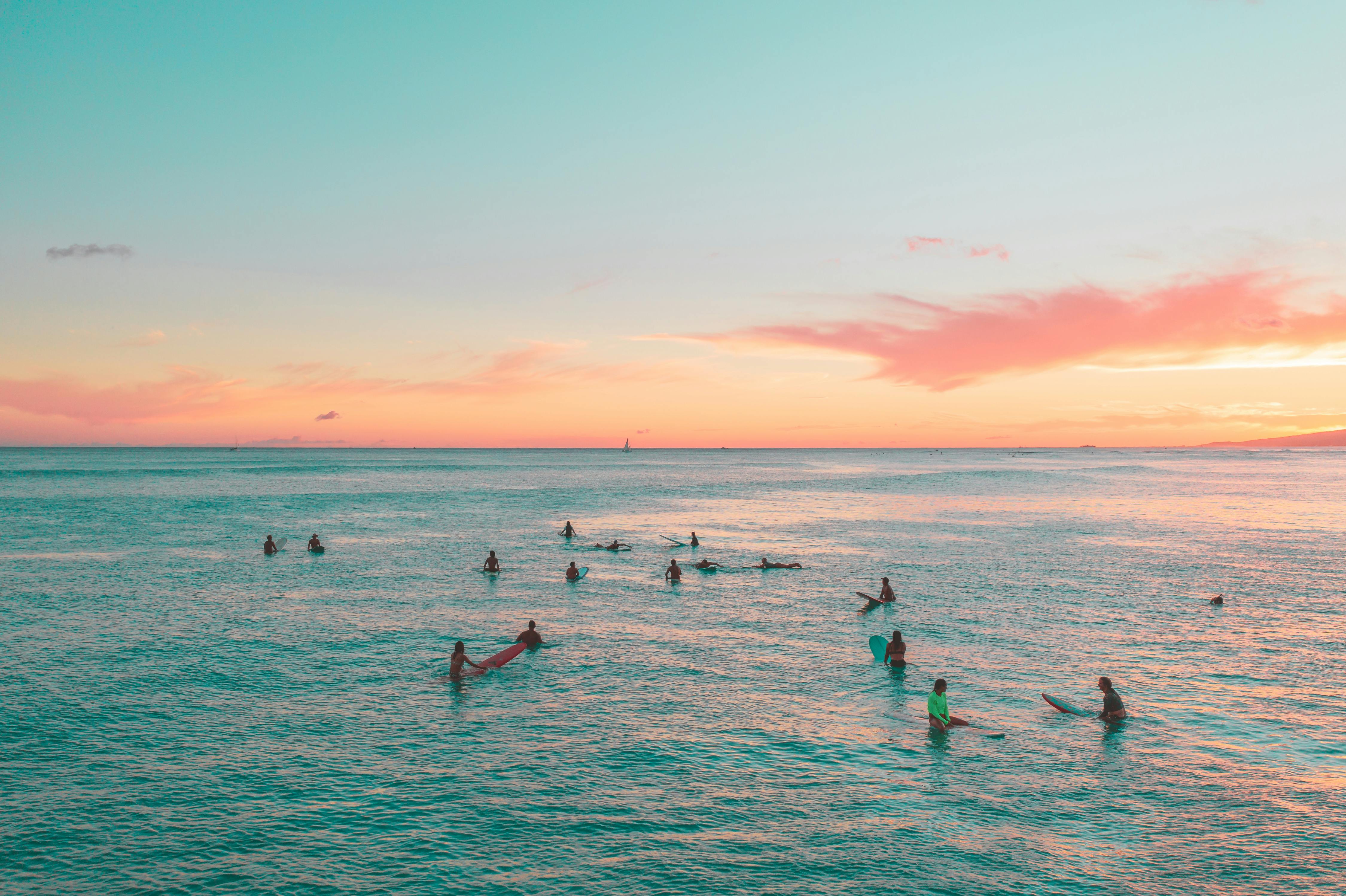 People in Sea during Sunset · Free Stock Photo