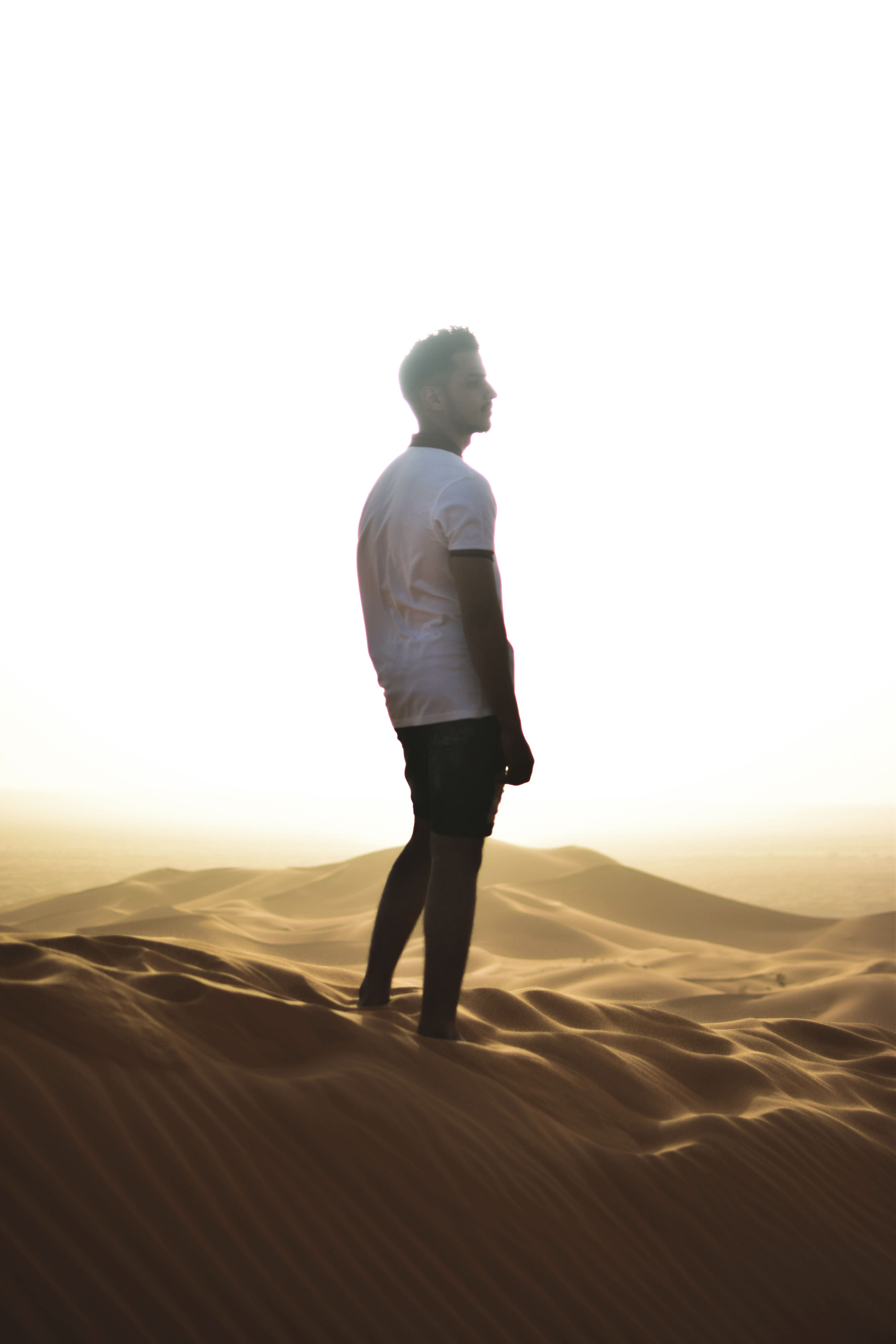 Man Standing on Sand · Free Stock Photo