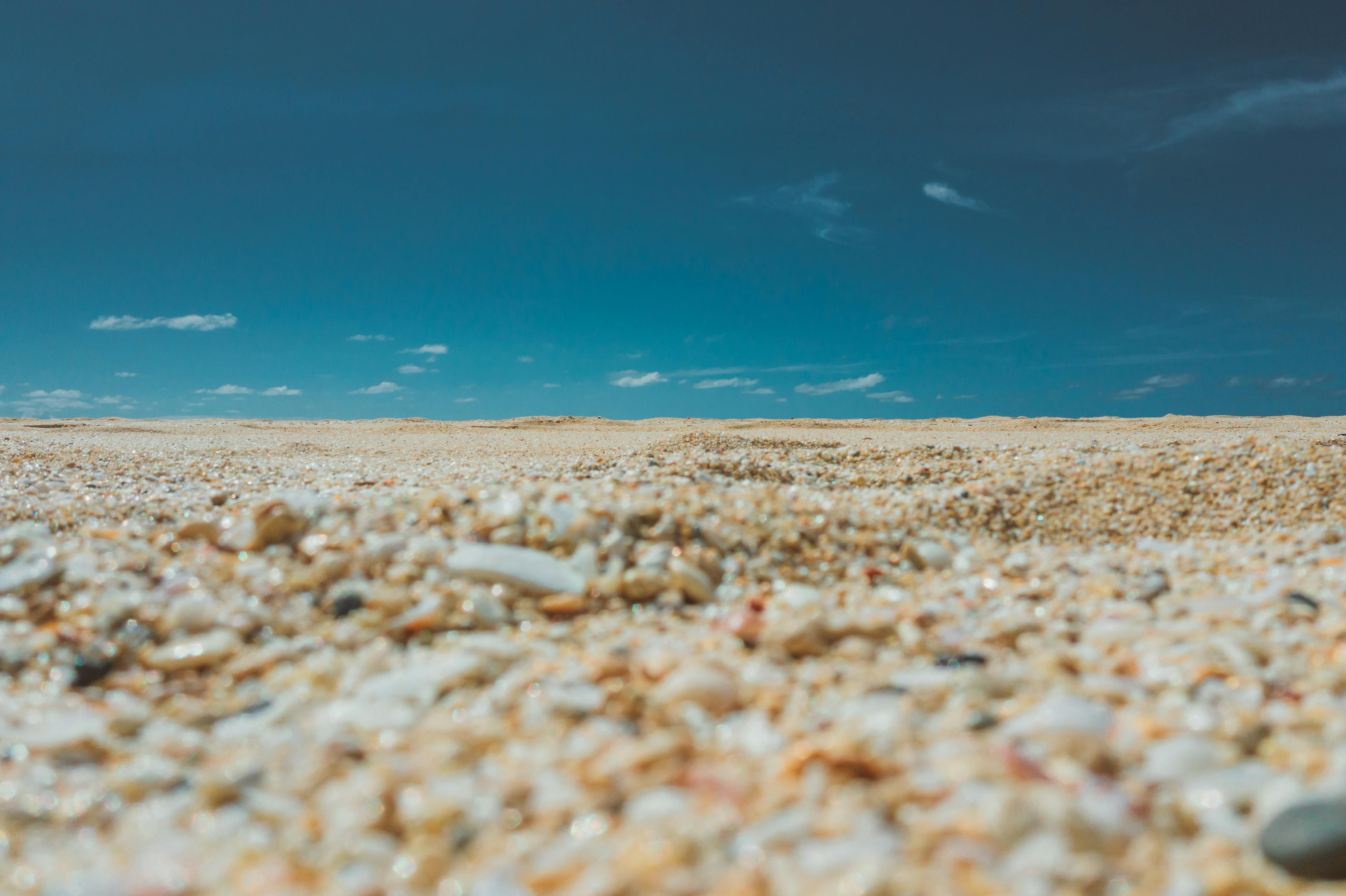 Low-Angle Shot of Pebbles on the Beach · Free Stock Photo