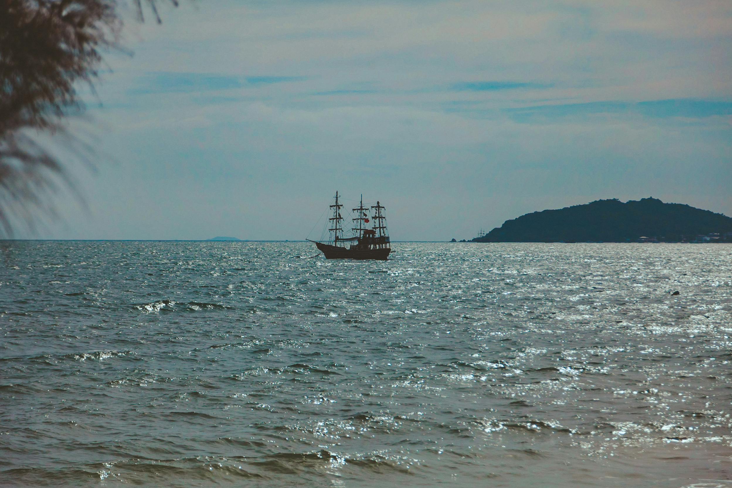 Unrecognizable tourist contemplating sea from shore at sunset · Free ...