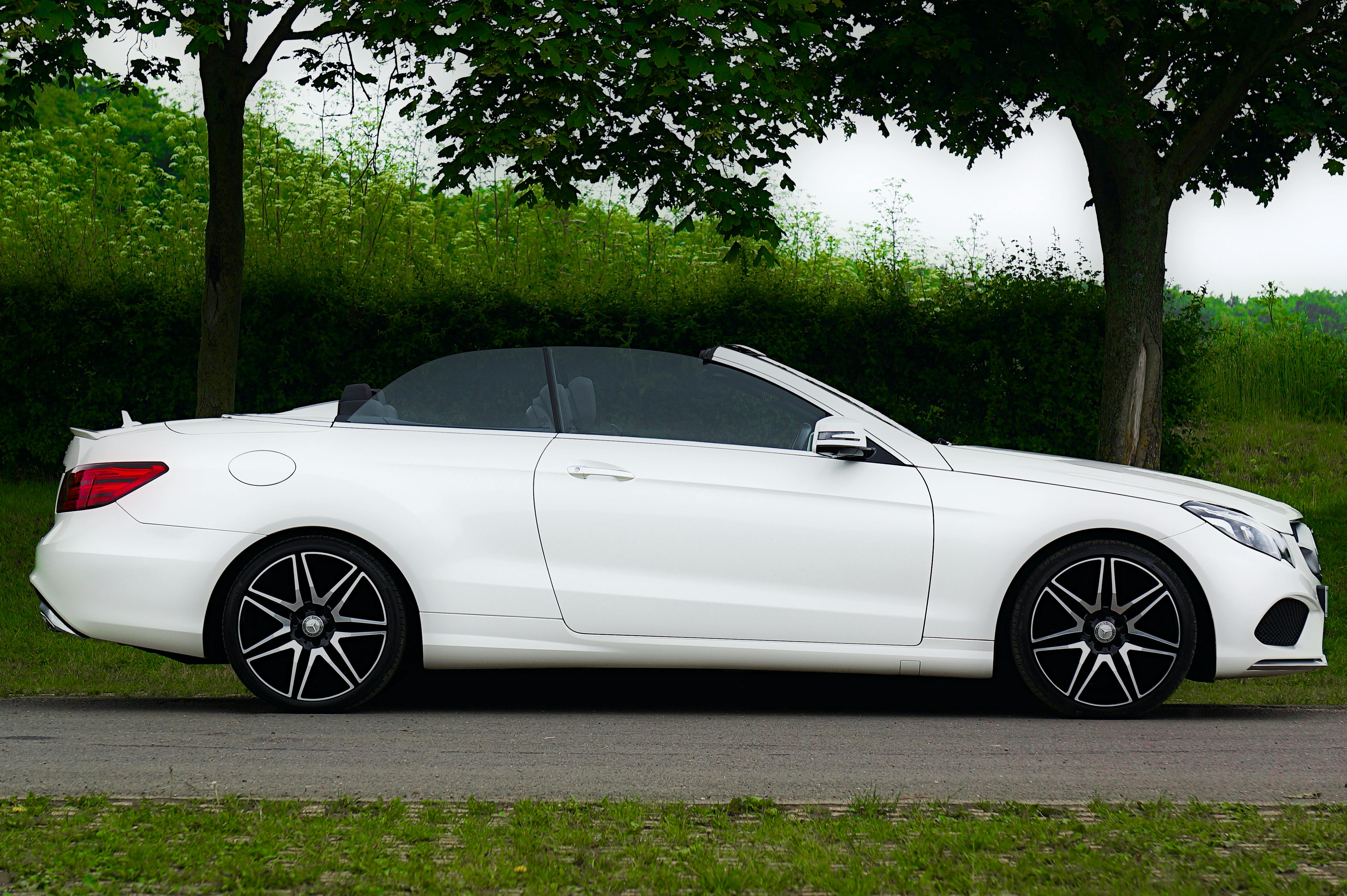 White Convertible Coupe Parked on Green Grass Field · Free Stock Photo
