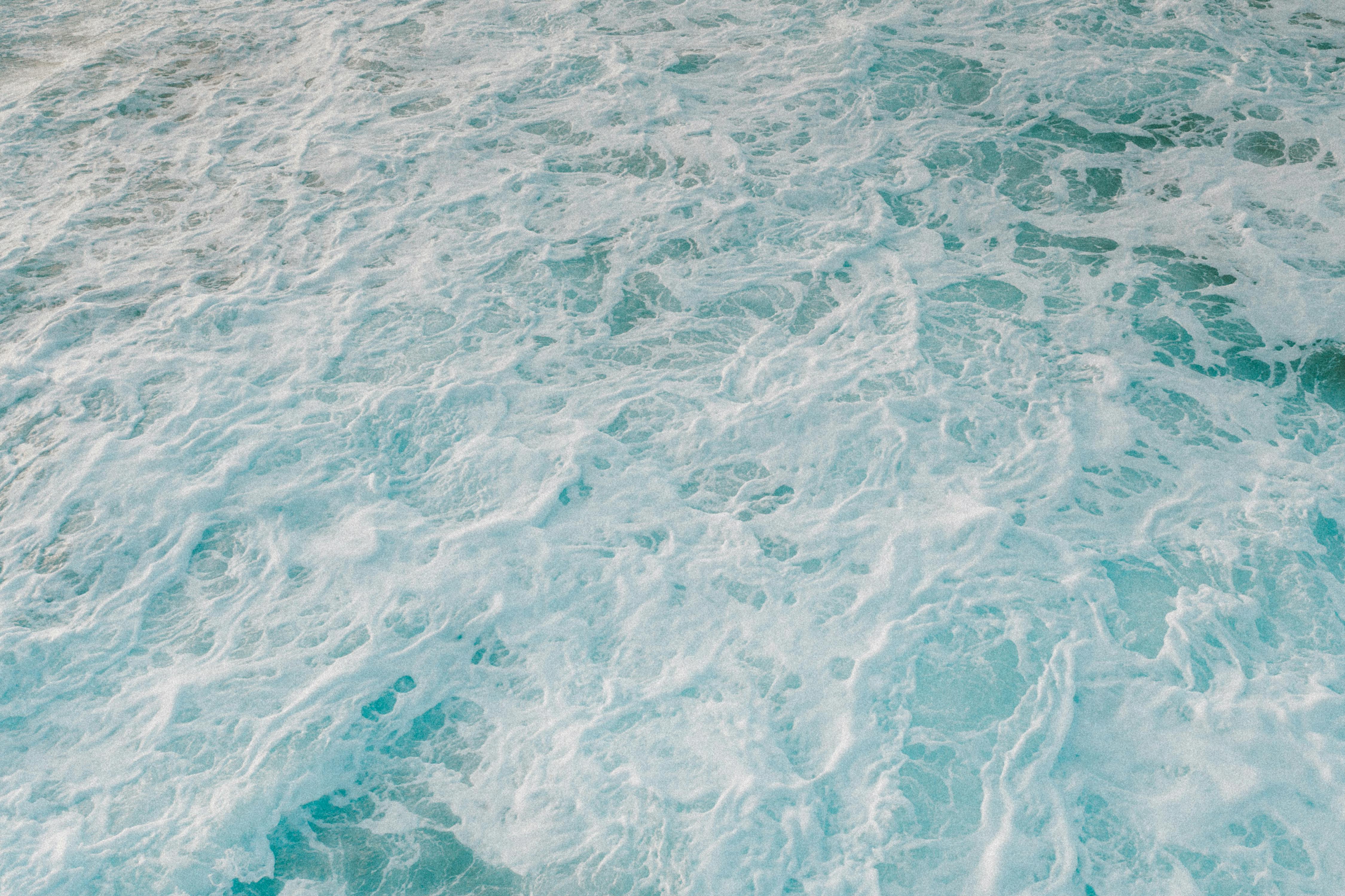 Sea Water forming Seafoams · Free Stock Photo