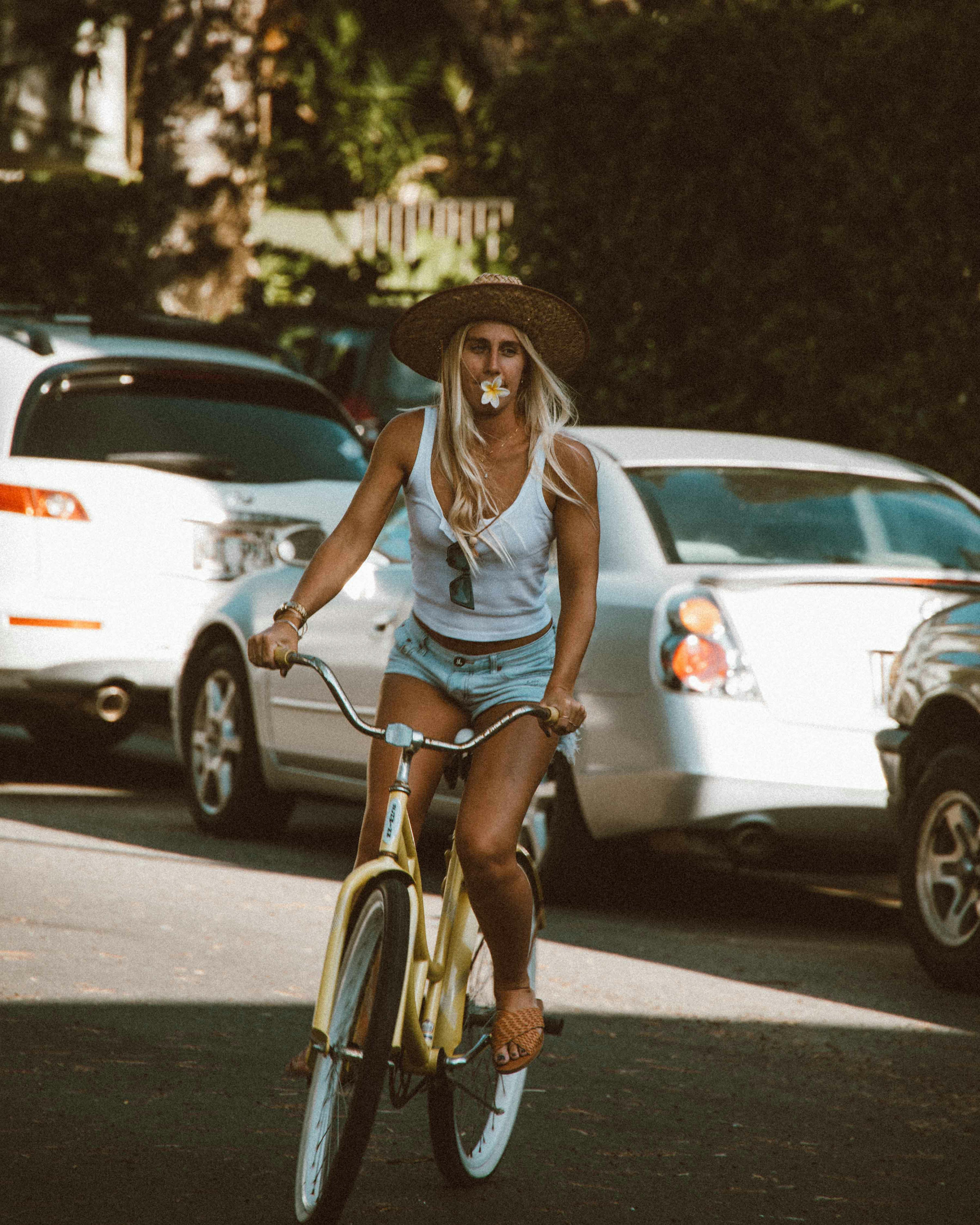 A Beautiful Woman Riding a Bicycle · Free Stock Photo