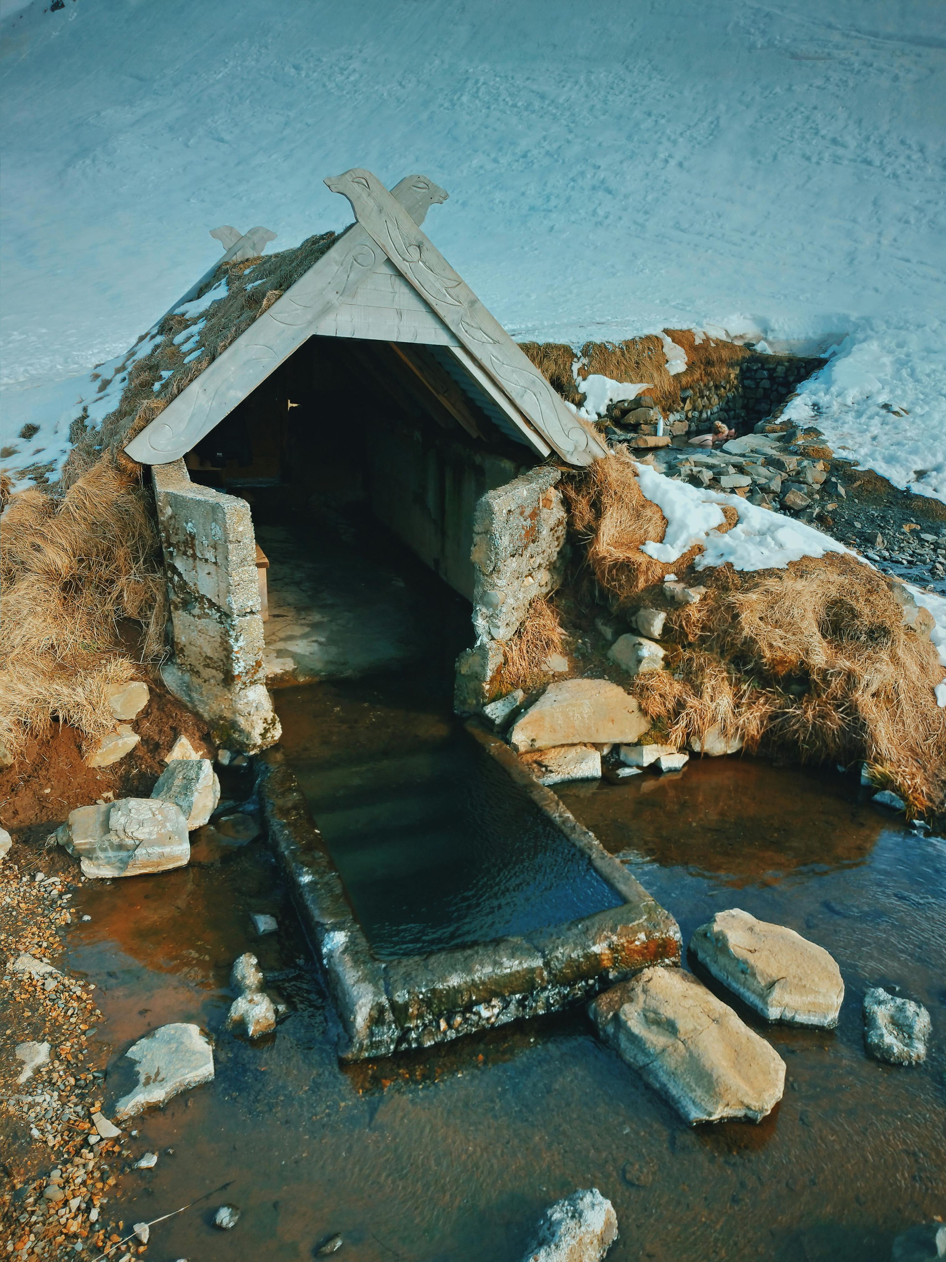 Entrance to pit house filled with water · Free Stock Photo
