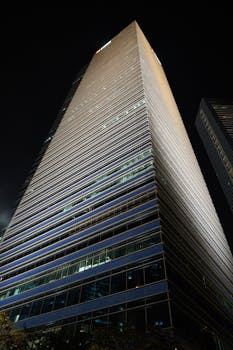Low Angle Photography of Brown Concrete High Rise Building Beside ...