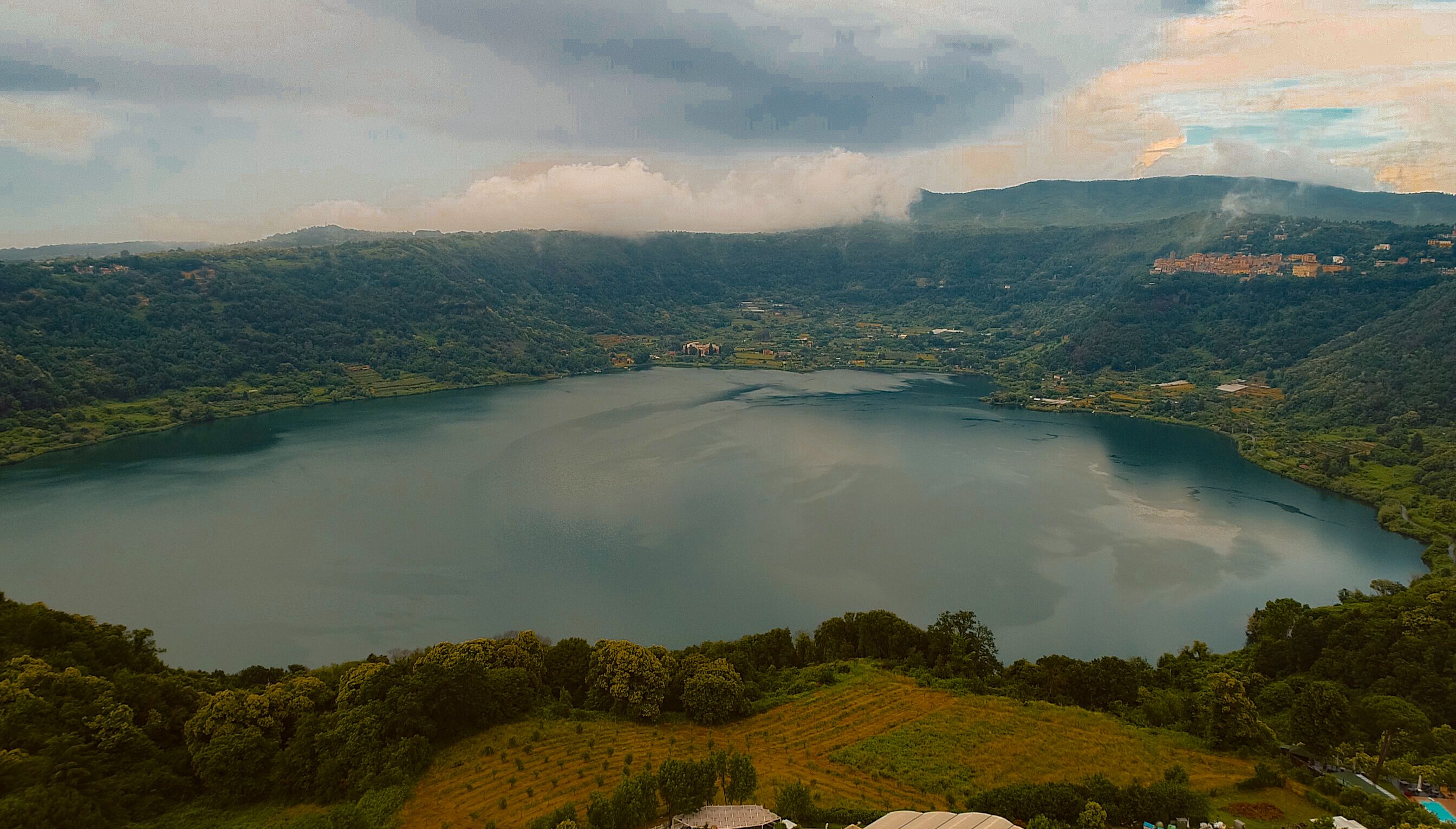 Breathtaking scenery of big blue lake surrounded by green mountains ...
