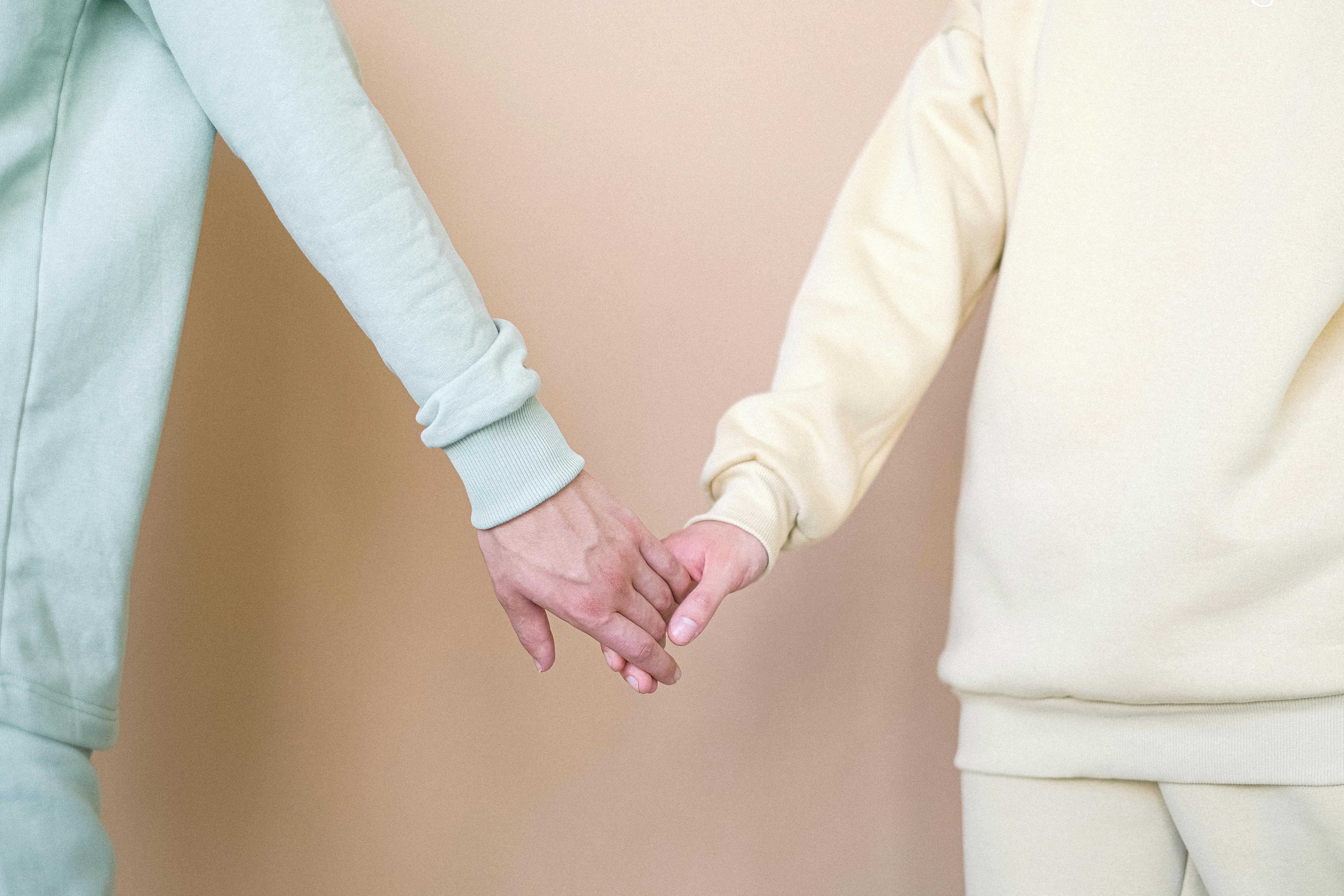 Close Up Shot of a Holding Hands · Free Stock Photo