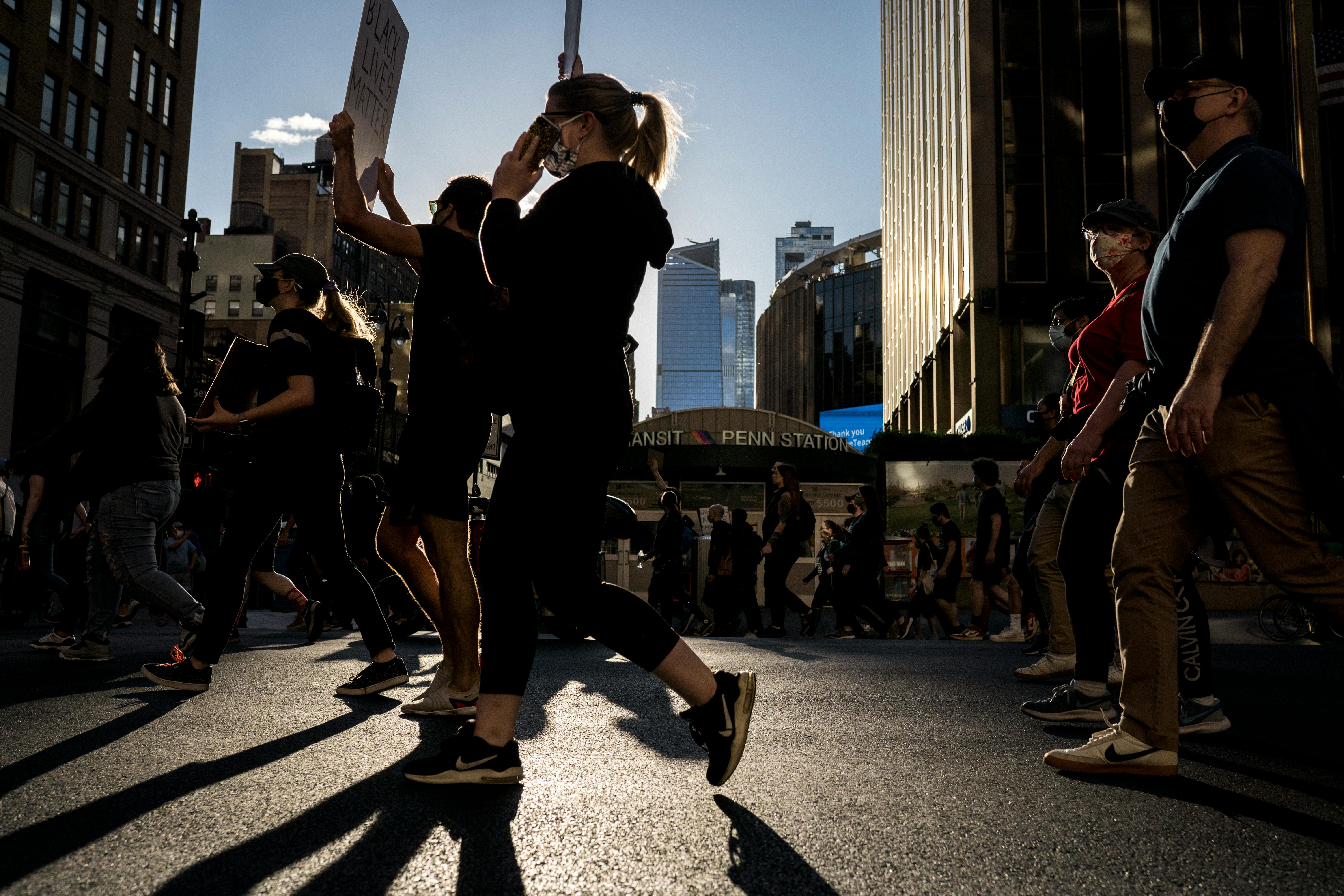 Crowd of Protesters Walking on a Street · Free Stock Photo