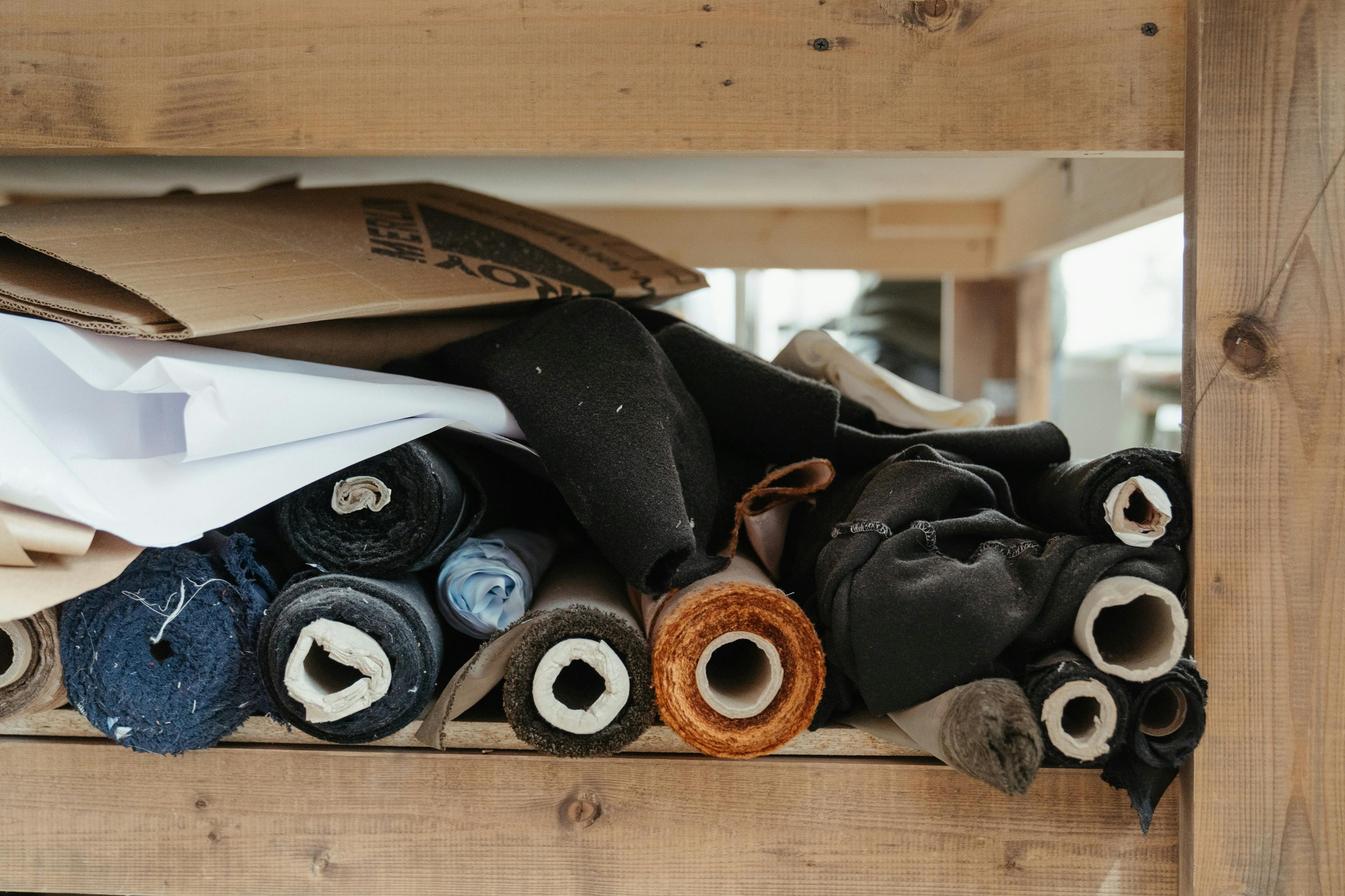 Various rolls of dyed textile · Free Stock Photo