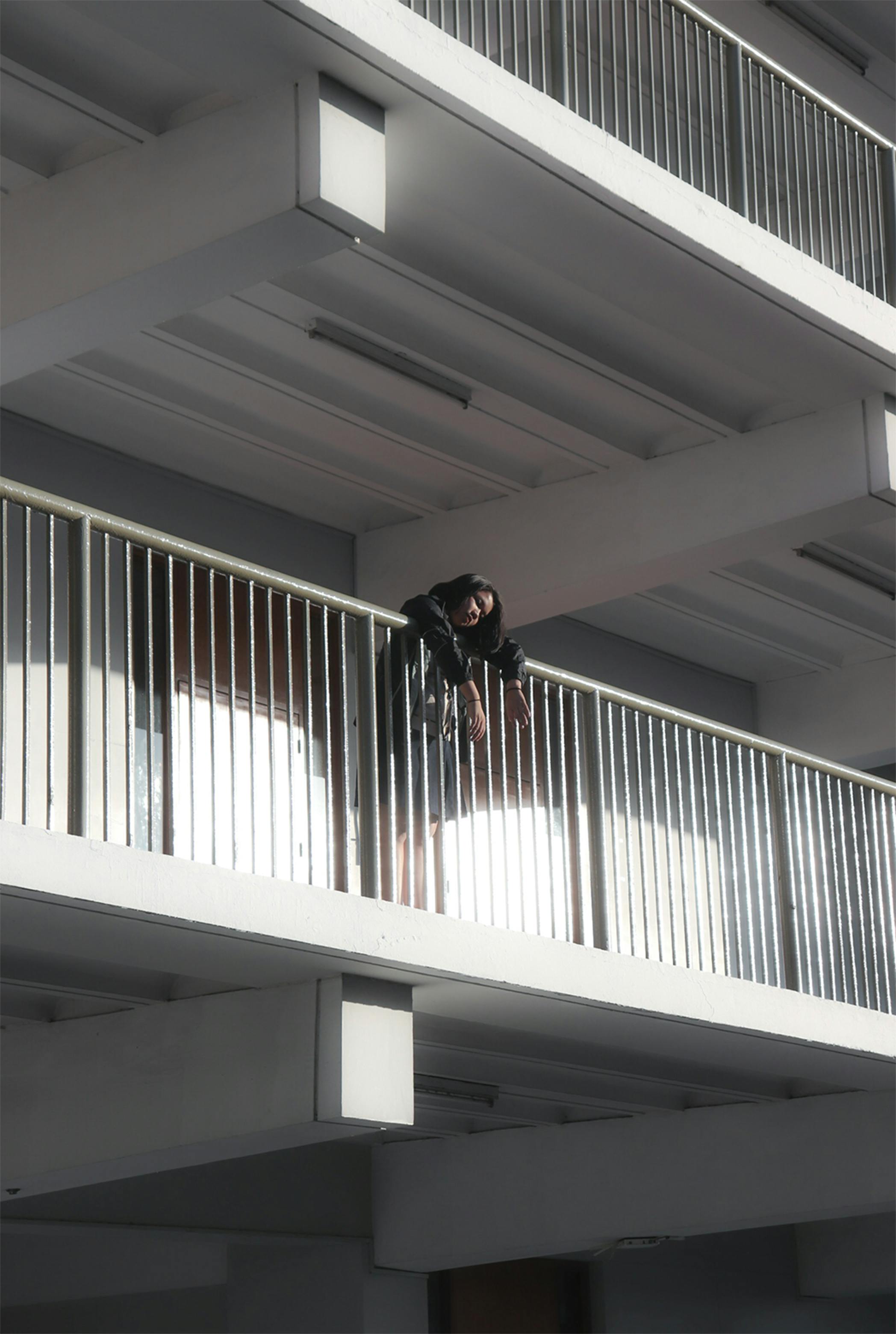Person Leaning on Metal Railings · Free Stock Photo