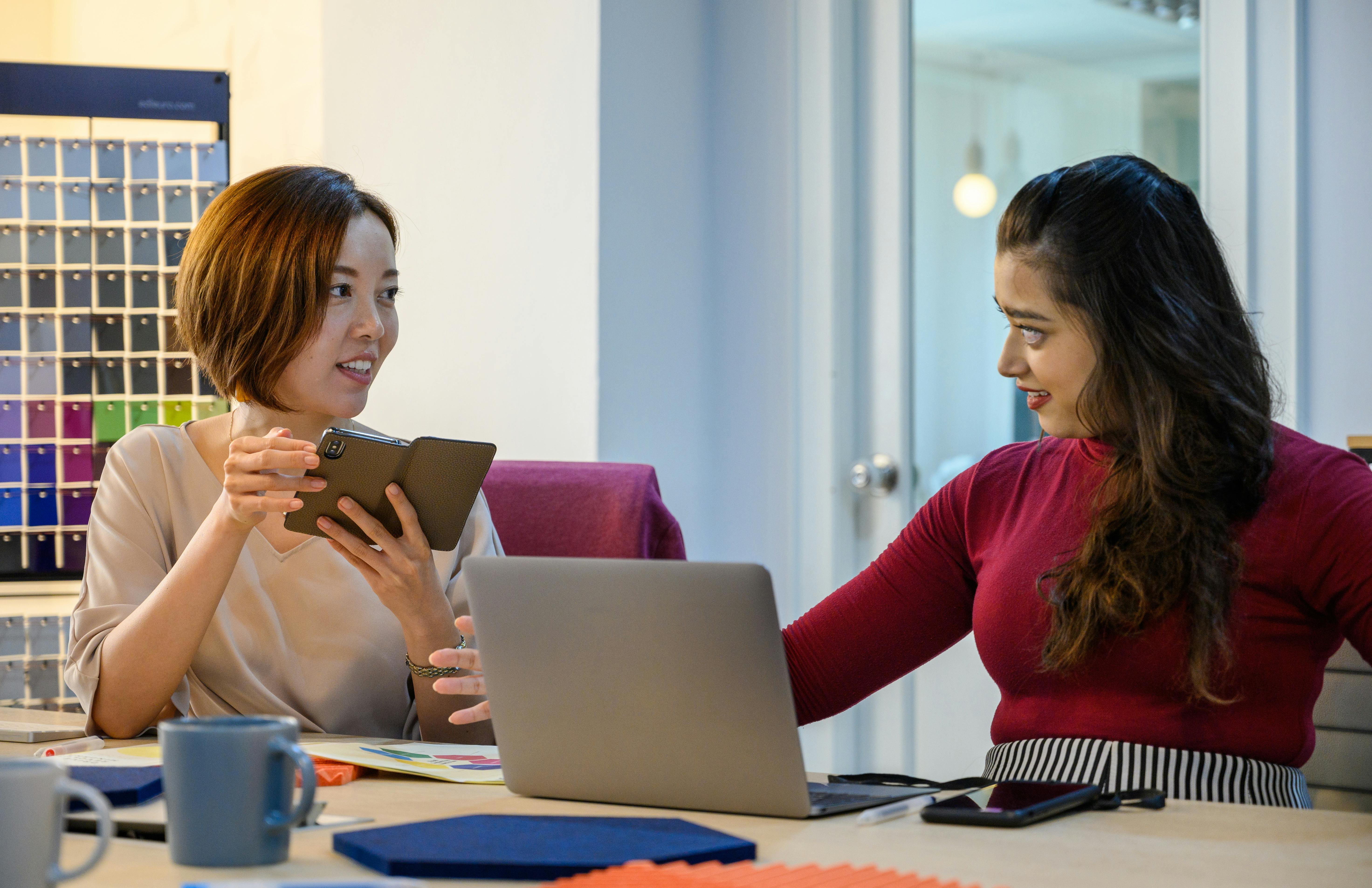 A Woman Sitting in Behind a Round Table · Free Stock Photo