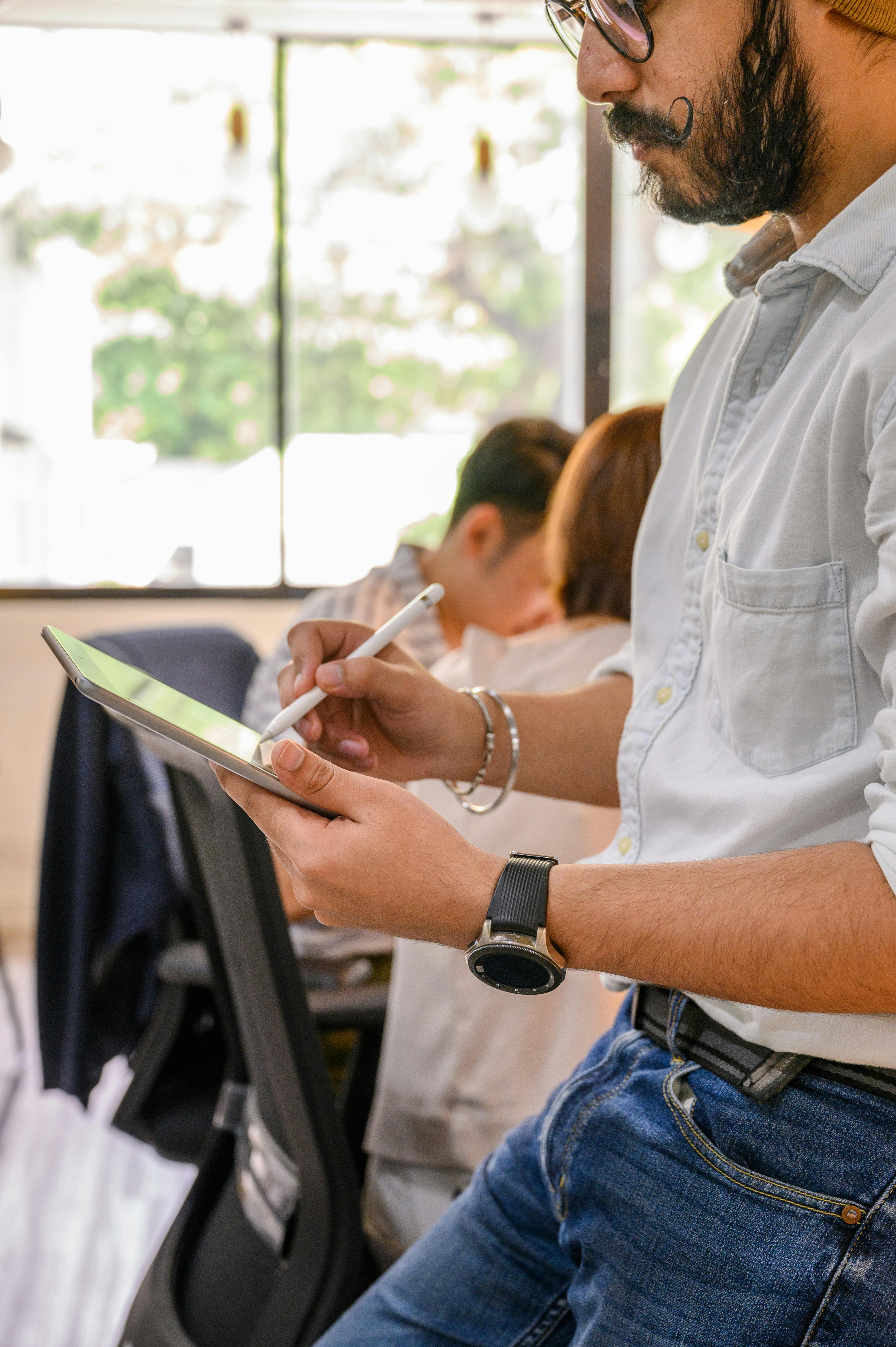 Bearded Man Using an Apple Pencil on Ipad · Free Stock Photo