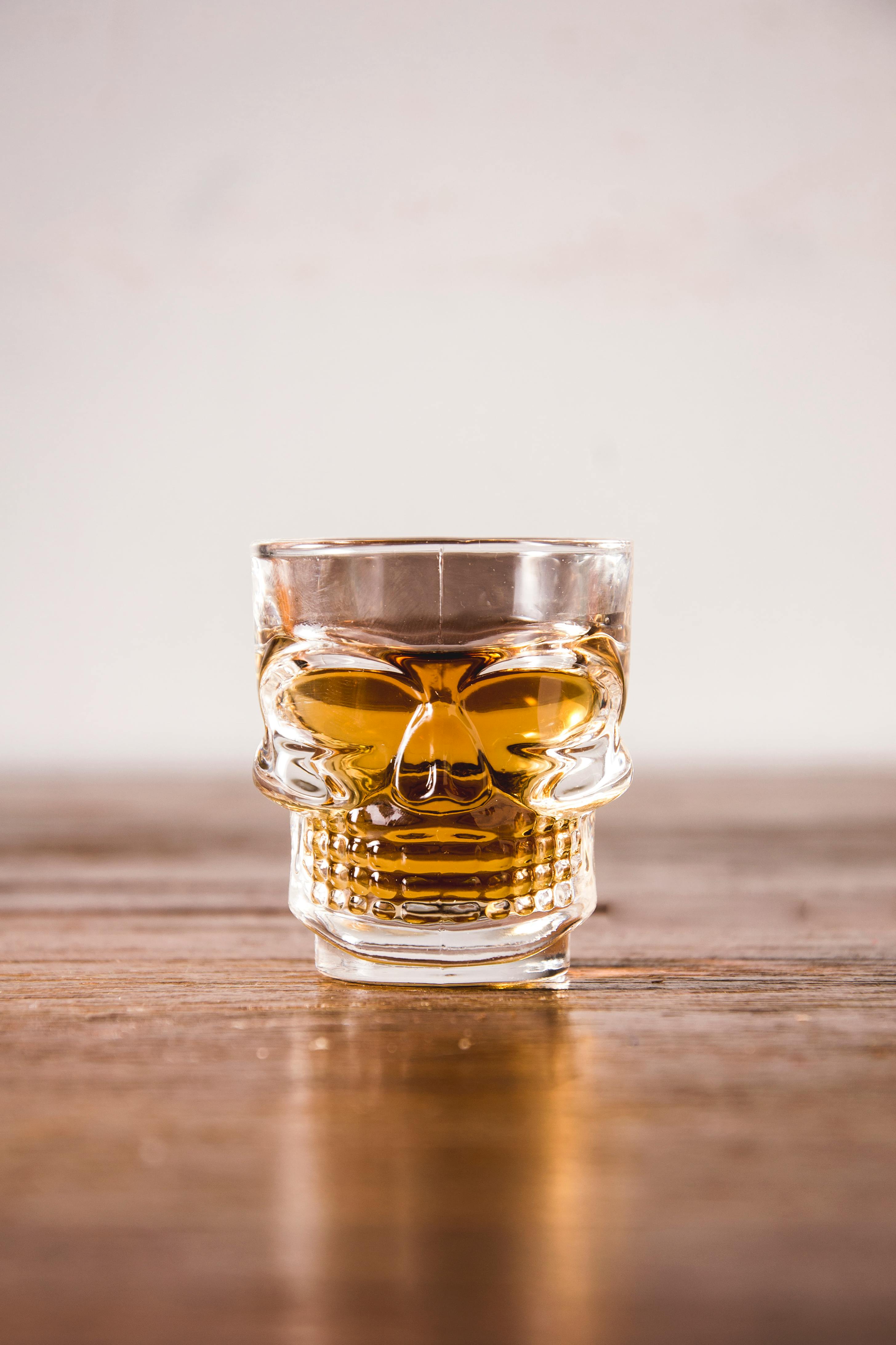 Clear Shot Glass With Yellow Liquid · Free Stock Photo