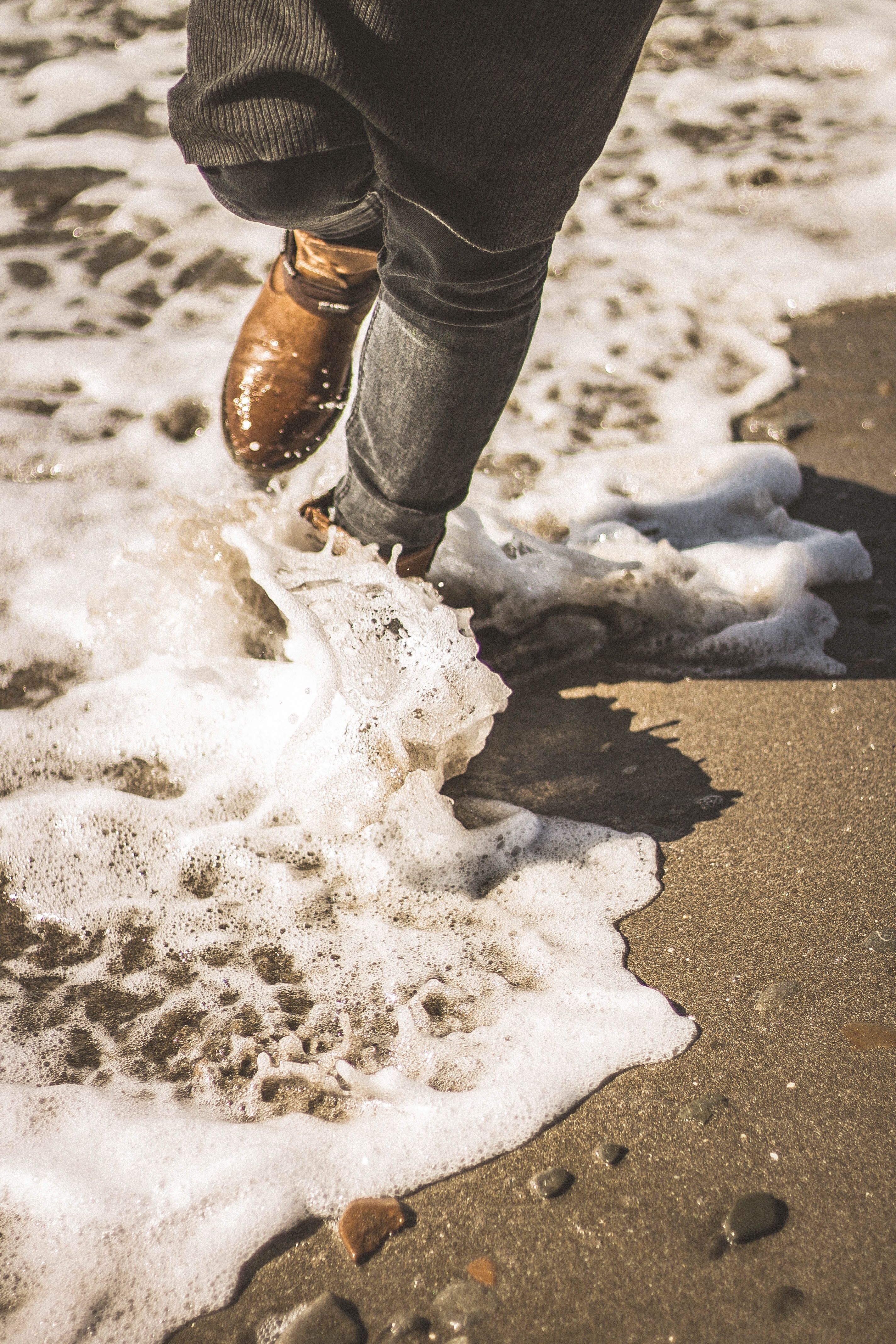 Human Feet on Shore with Sea Foam · Free Stock Photo