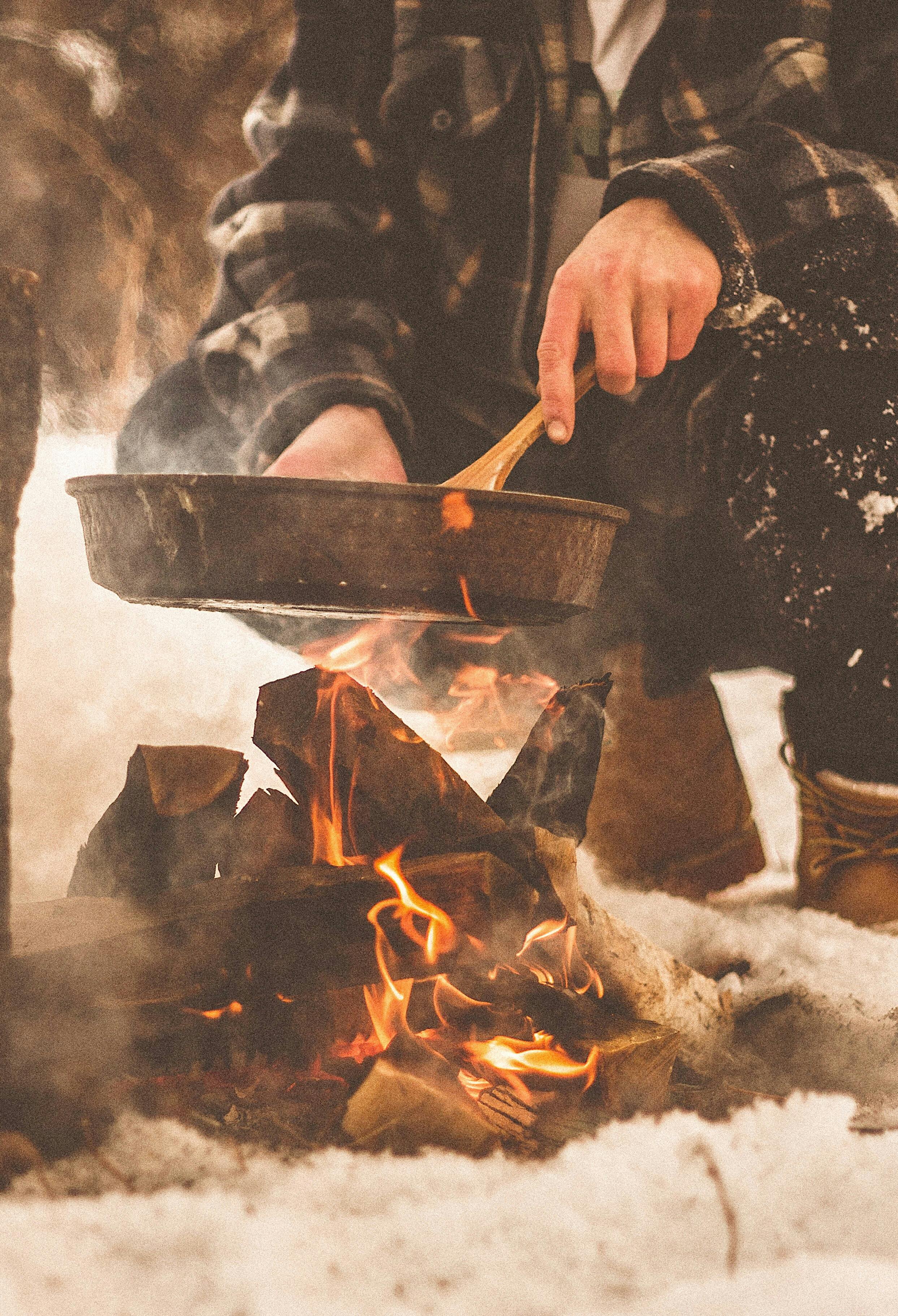 Person Holding a Frying Pan · Free Stock Photo