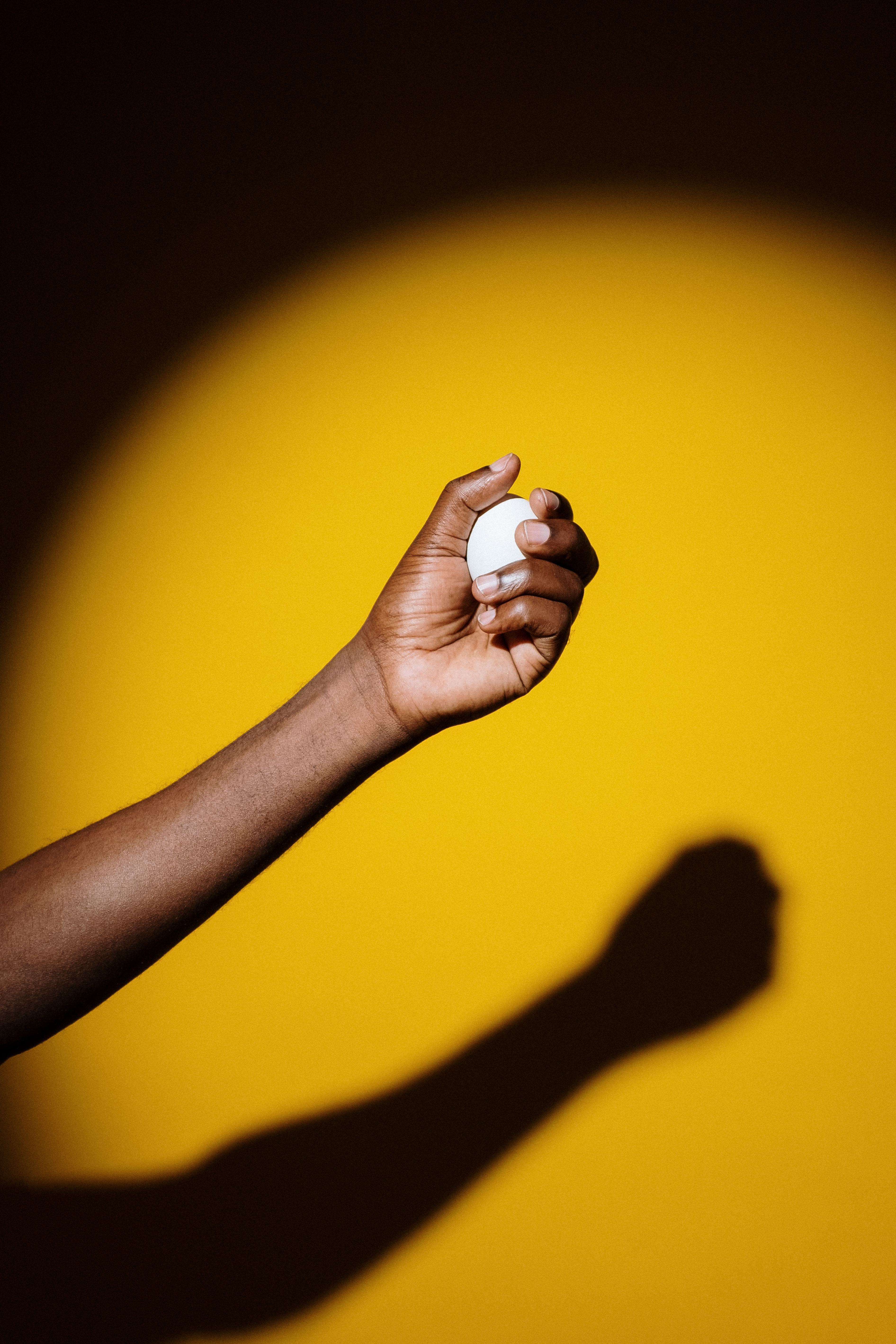 Person Holding Silver Pin on Left Hand · Free Stock Photo