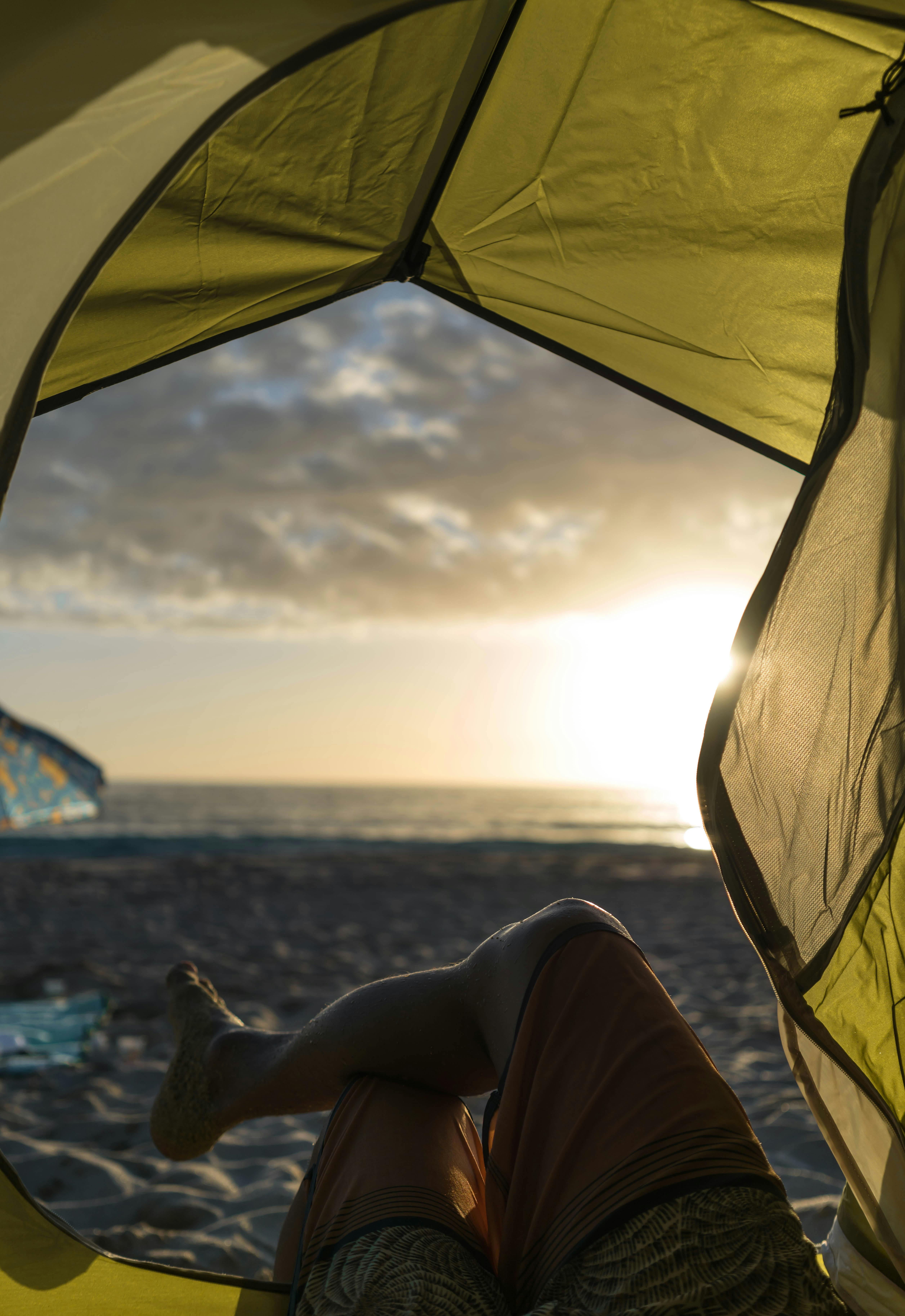 Photo Of Person Laying On Tent · Free Stock Photo