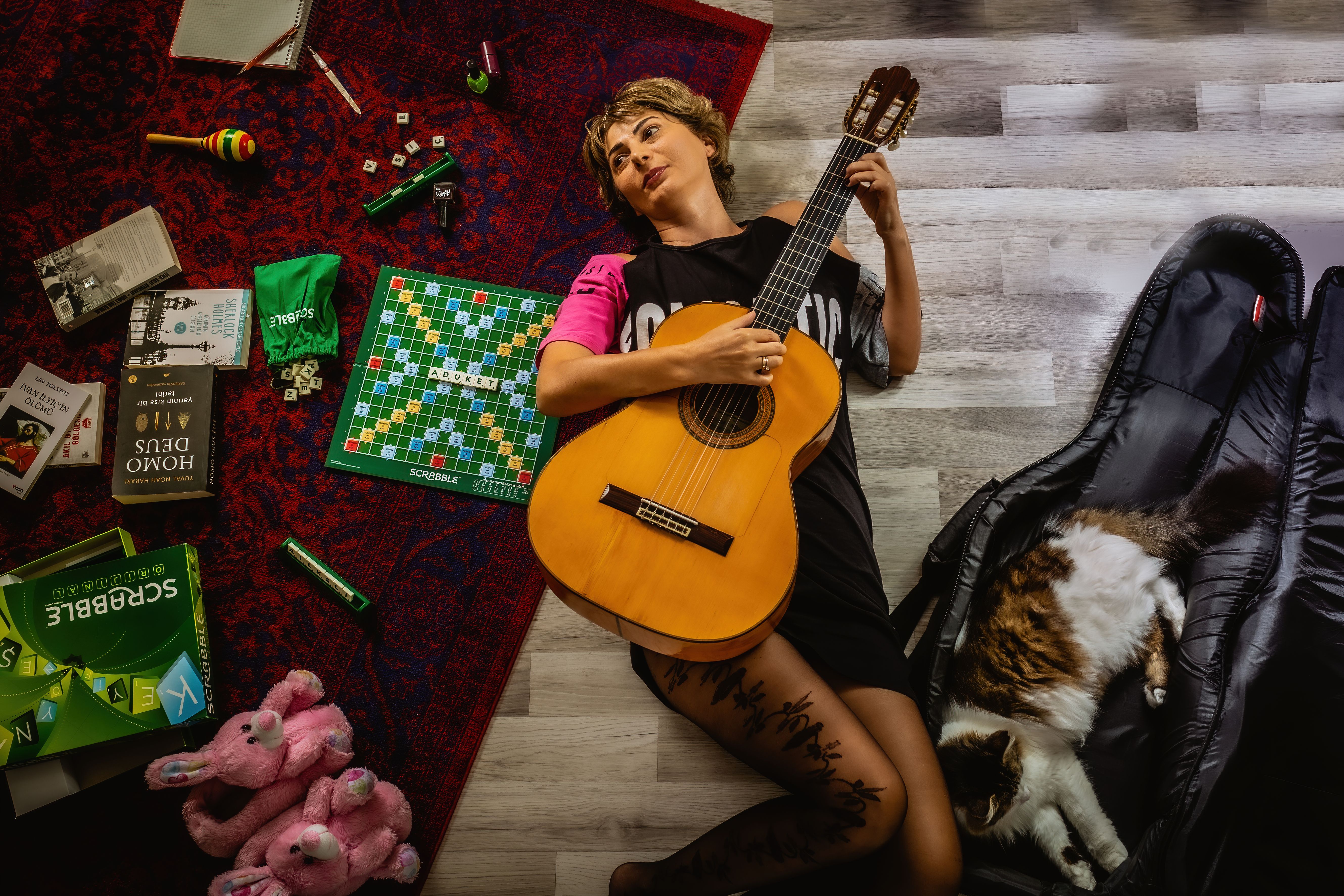 Photo Of Woman Holding Guitar · Free Stock Photo