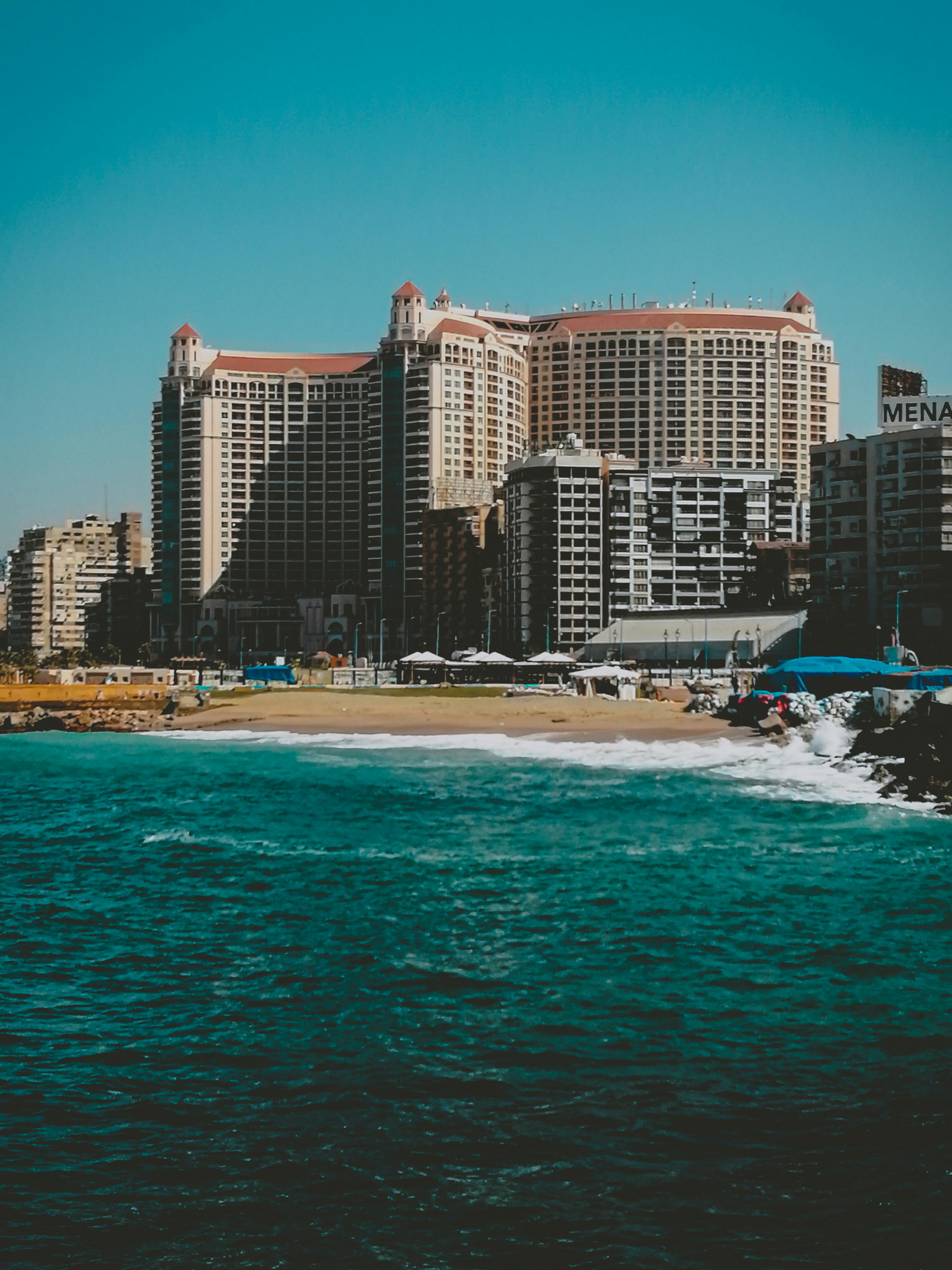 Photo Of Buildings Near Beach · Free Stock Photo
