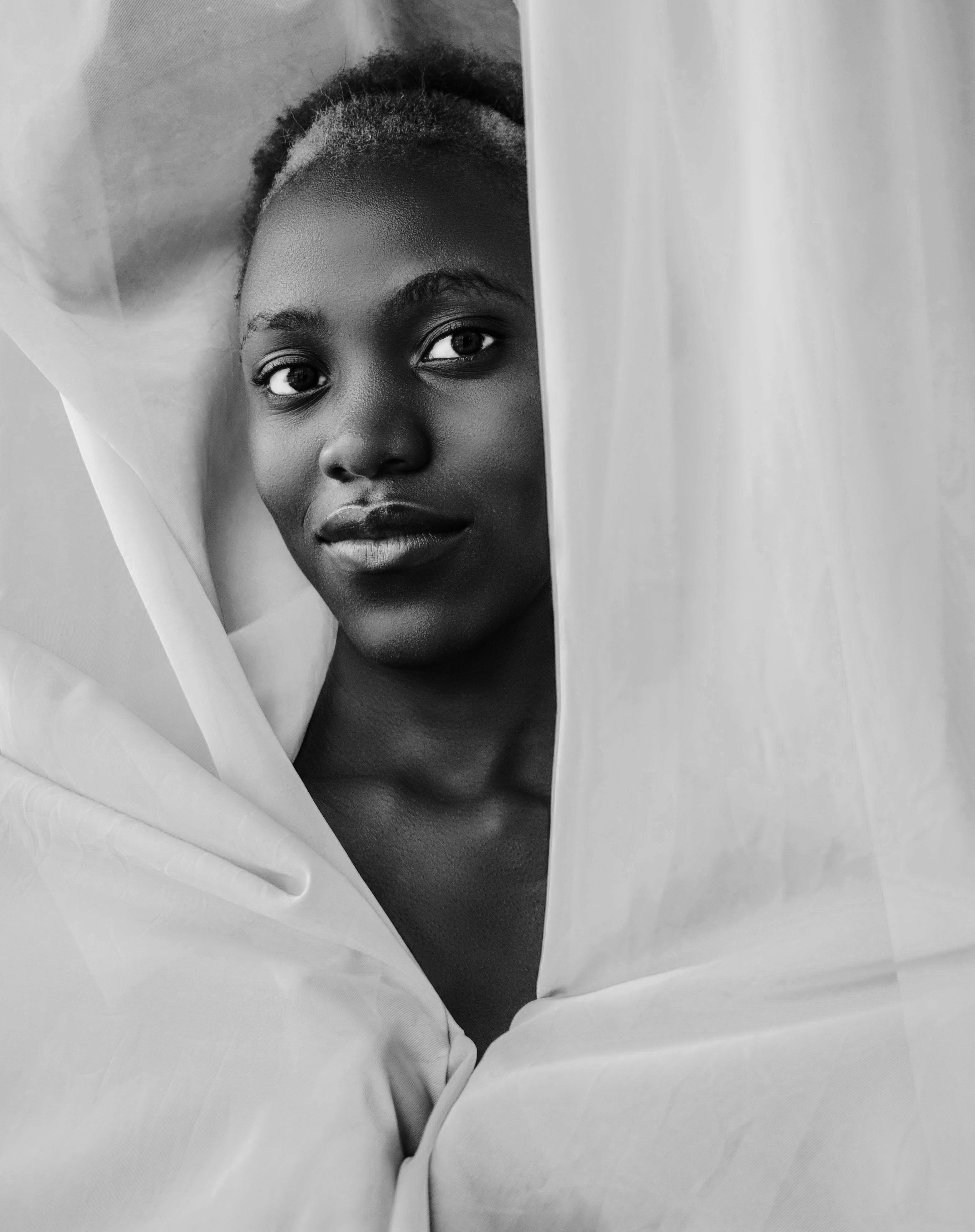 Black woman covering body with white cloth · Free Stock Photo